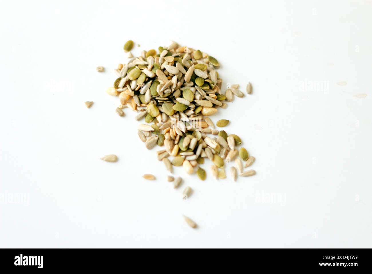 Mixed seeds on a white background Stock Photo - Alamy