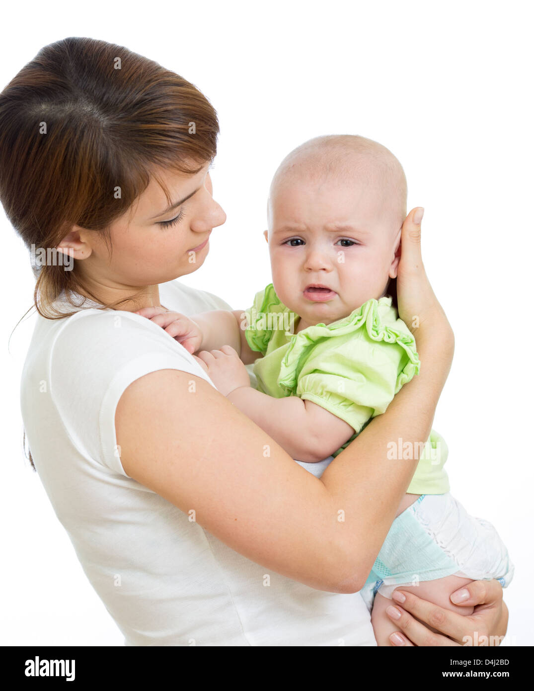 Mother trying to comfort her crying baby isolated Stock Photo - Alamy