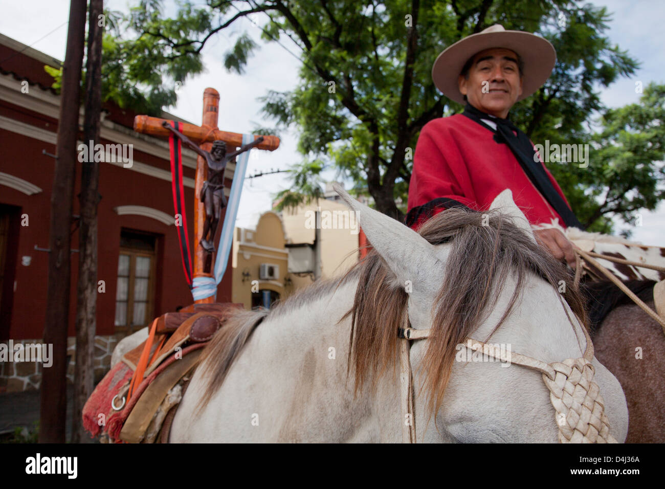 Gauchos with other horse with cross in traditional costumes in Salta ...