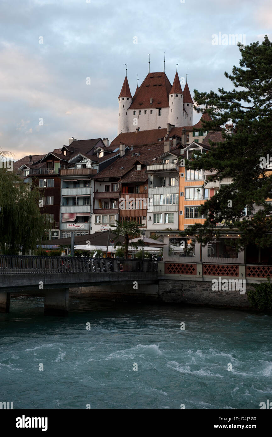 Thun, Switzerland, view over the river Aare to the old town at night ...