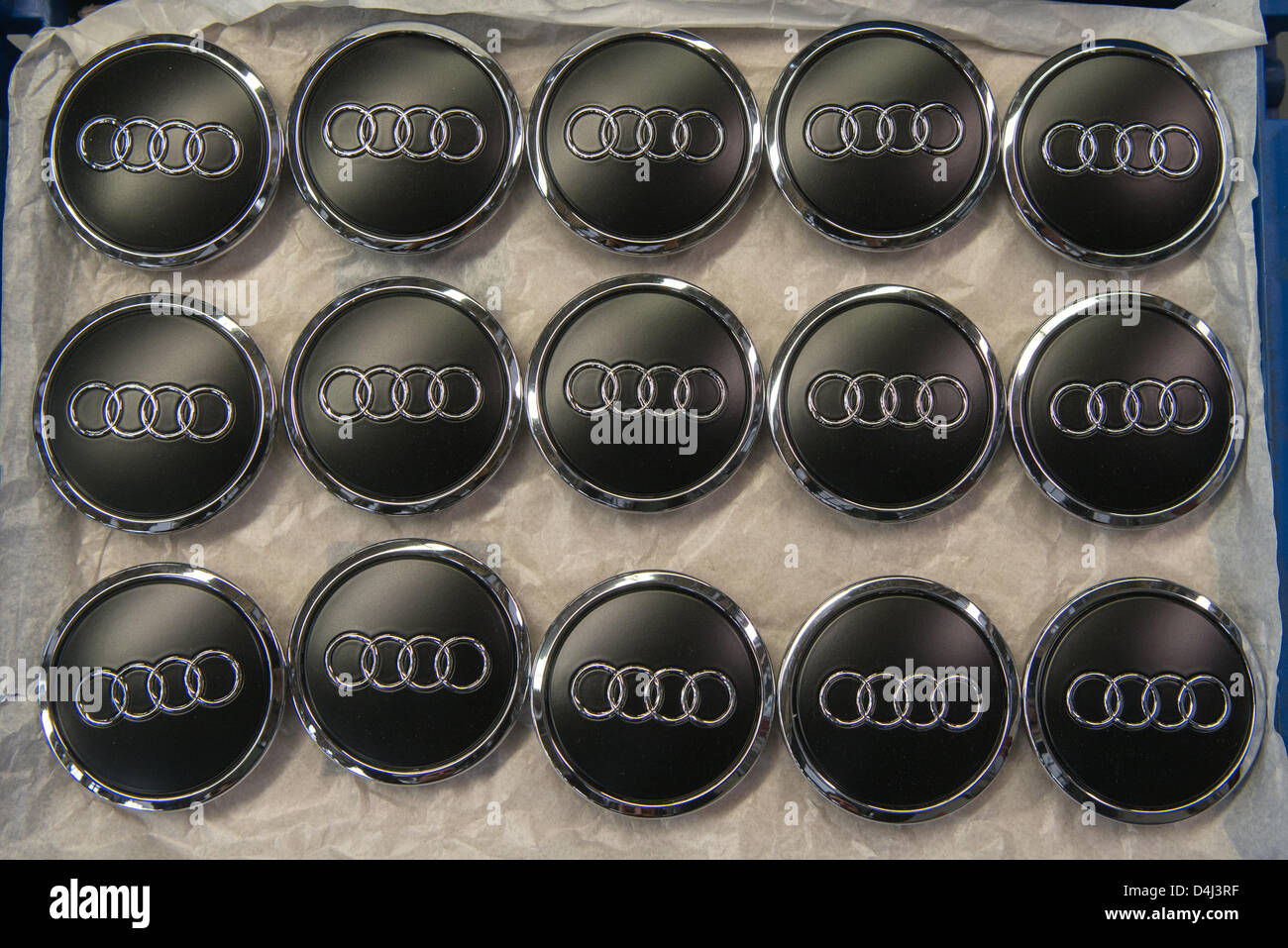 Audi emblems are ready to be mounted onto Audi A3's on the production ...