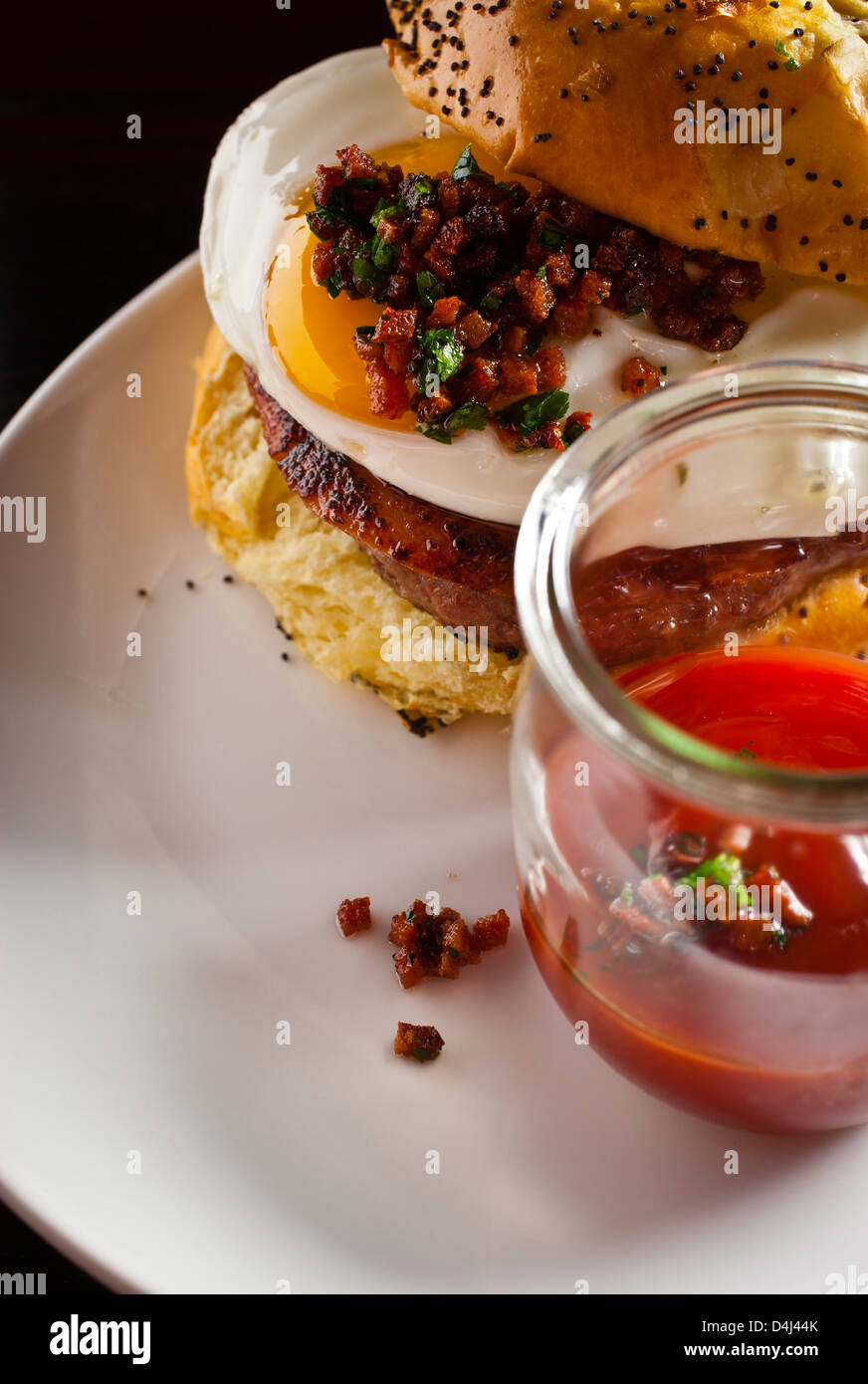 Burger Royal, with sunny side up egg, ham and ketchup prepared by Rob ...
