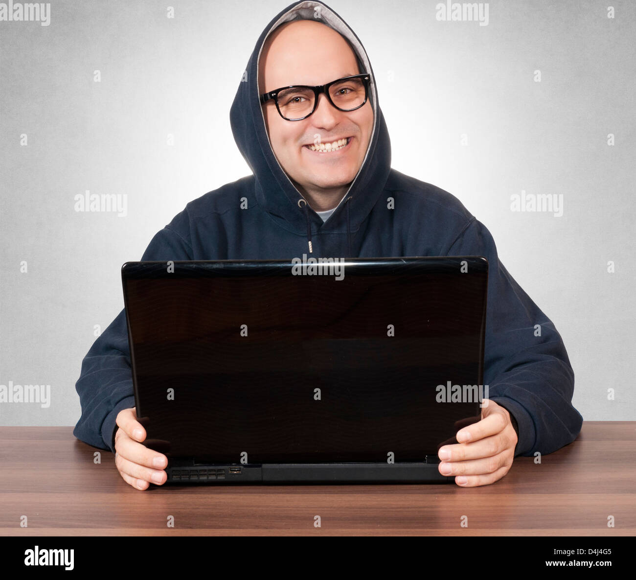 Happy man holding the lap top Stock Photo - Alamy