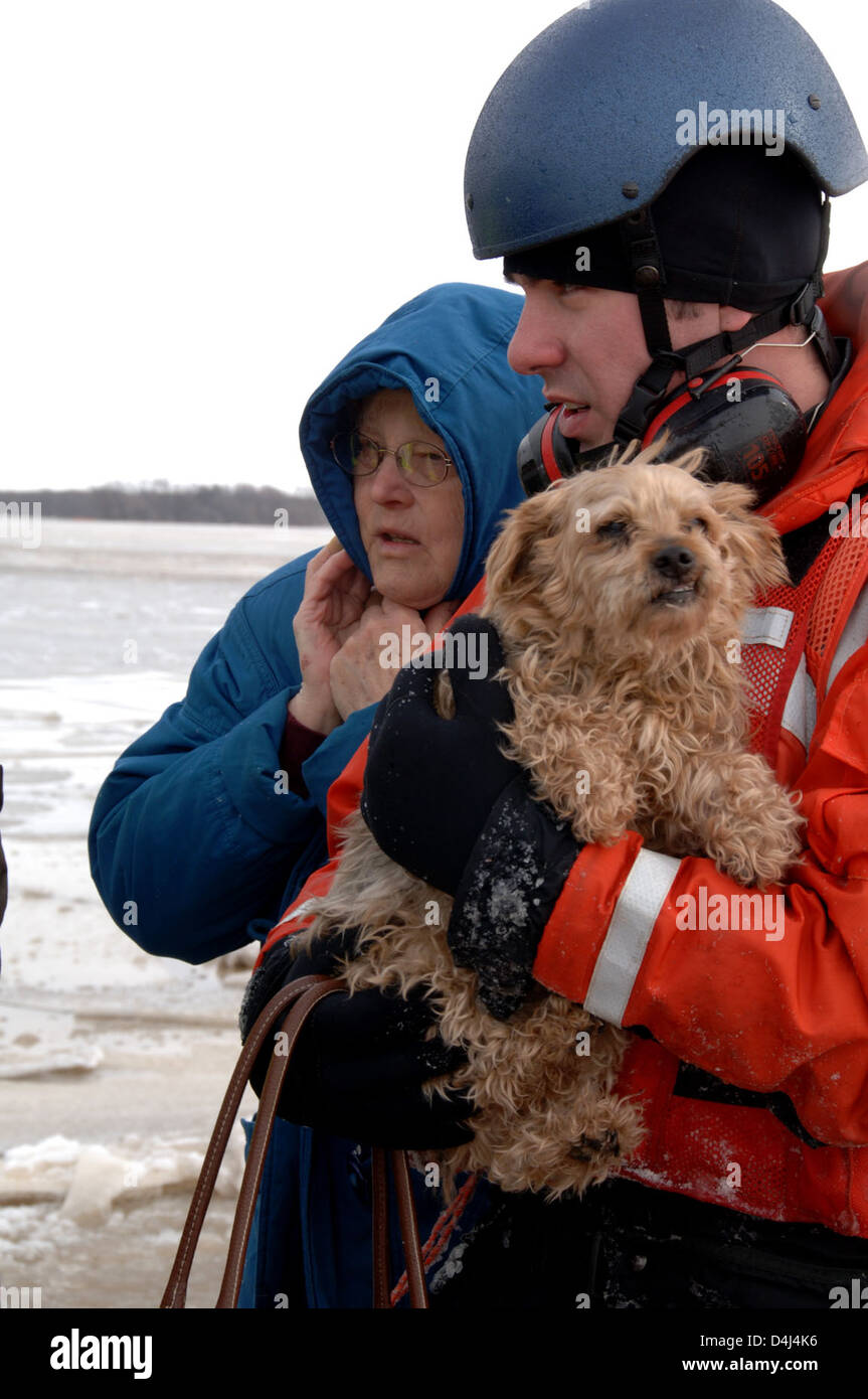 A Coast Guardsman participates in the evacuation of residents from ...