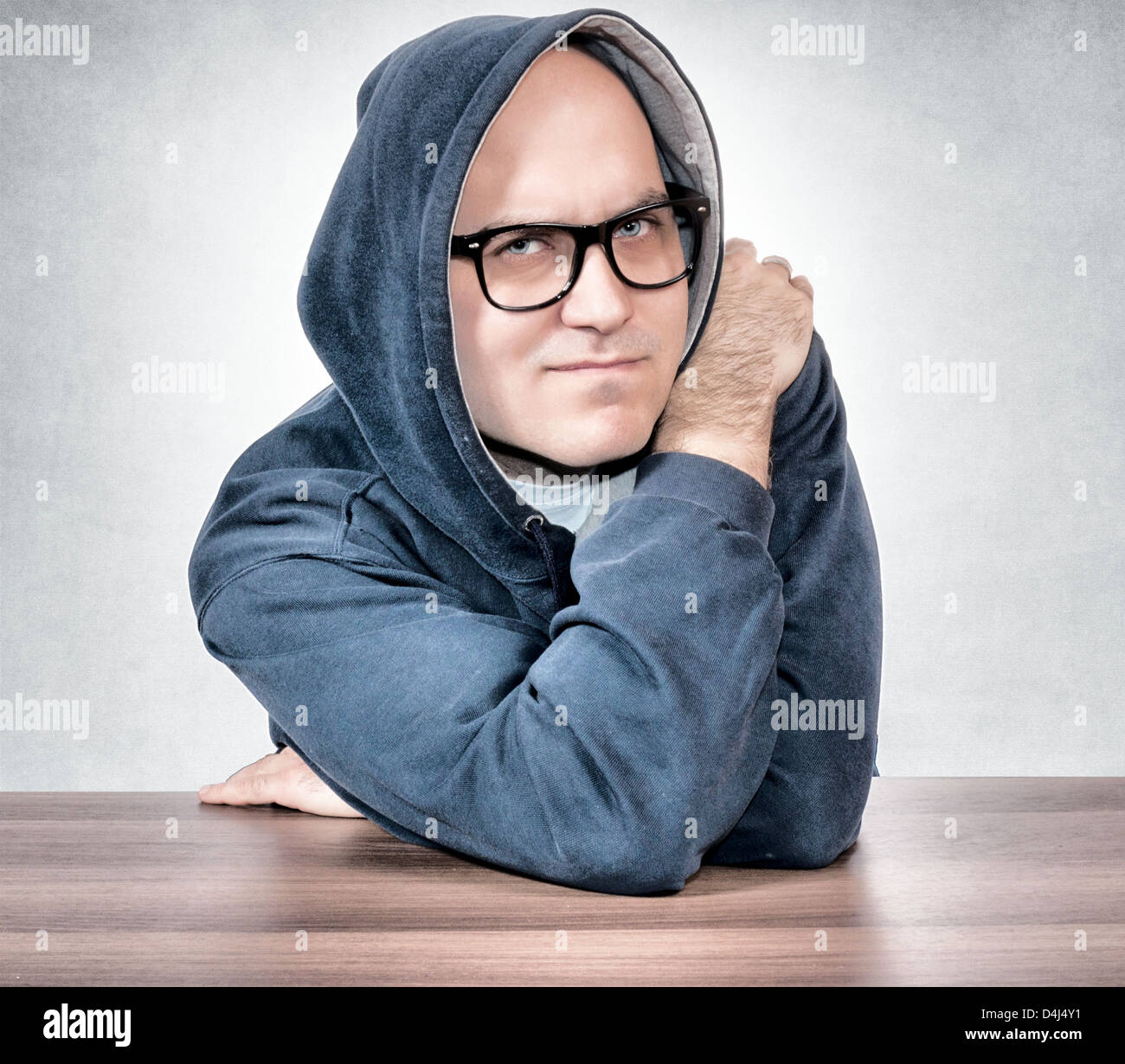 Suspicious man with a hood on his head Stock Photo - Alamy