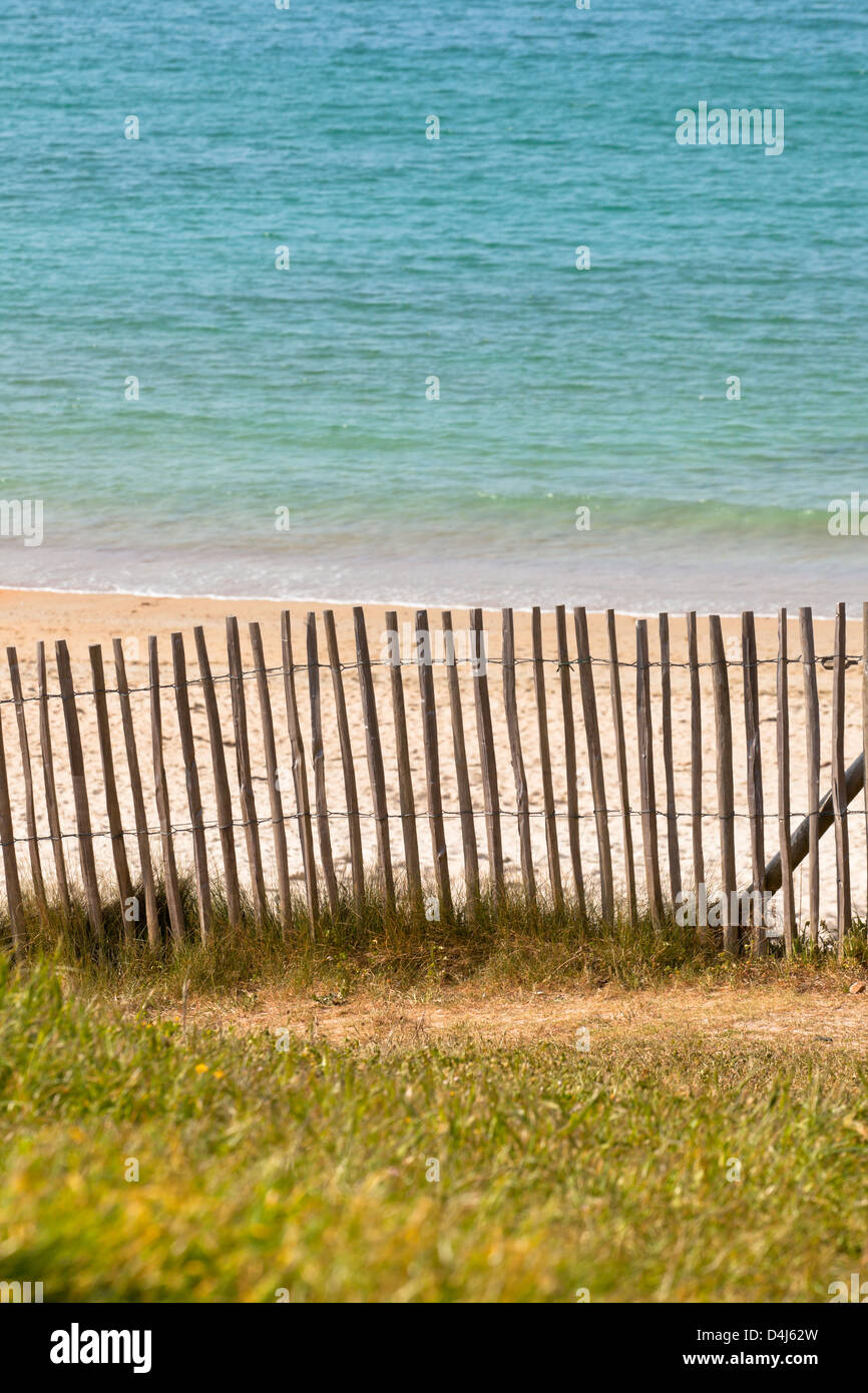 Wooden fence at northern beach in France. Vertical shot Stock Photo - Alamy