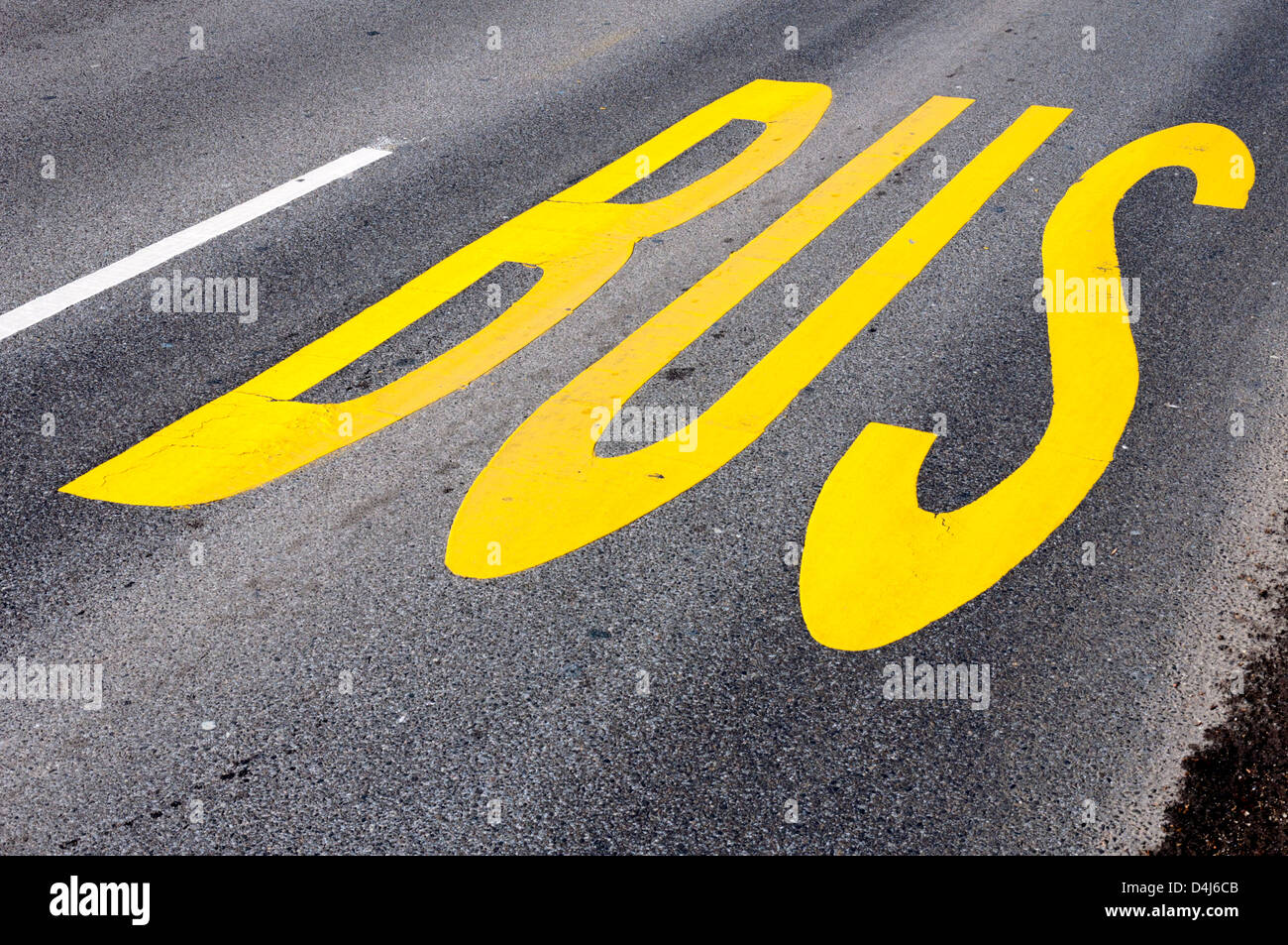 Yellow bus sign on the road Stock Photo - Alamy