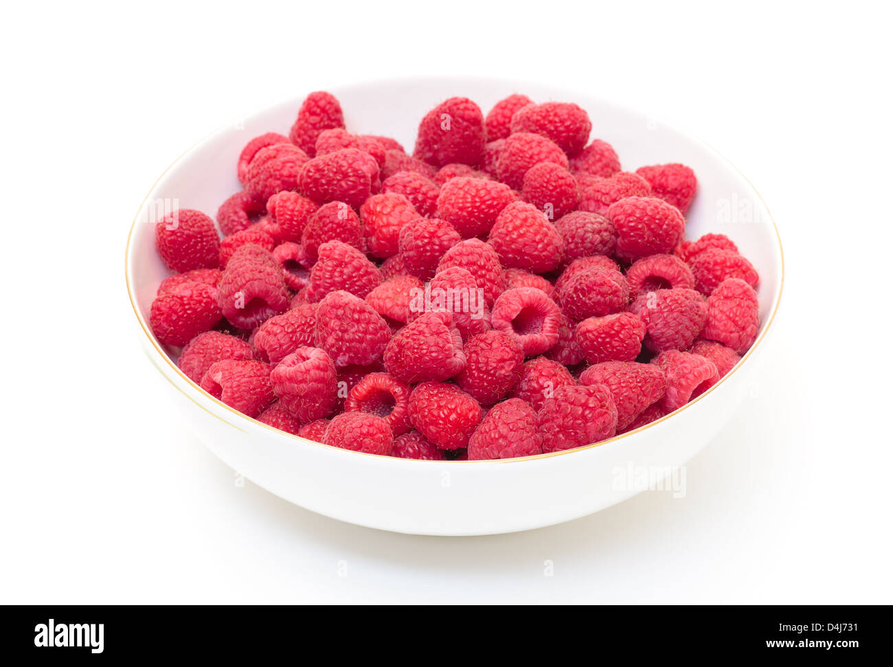 Ripe Berry Red Raspberry in Bowl on white background Stock Photo - Alamy