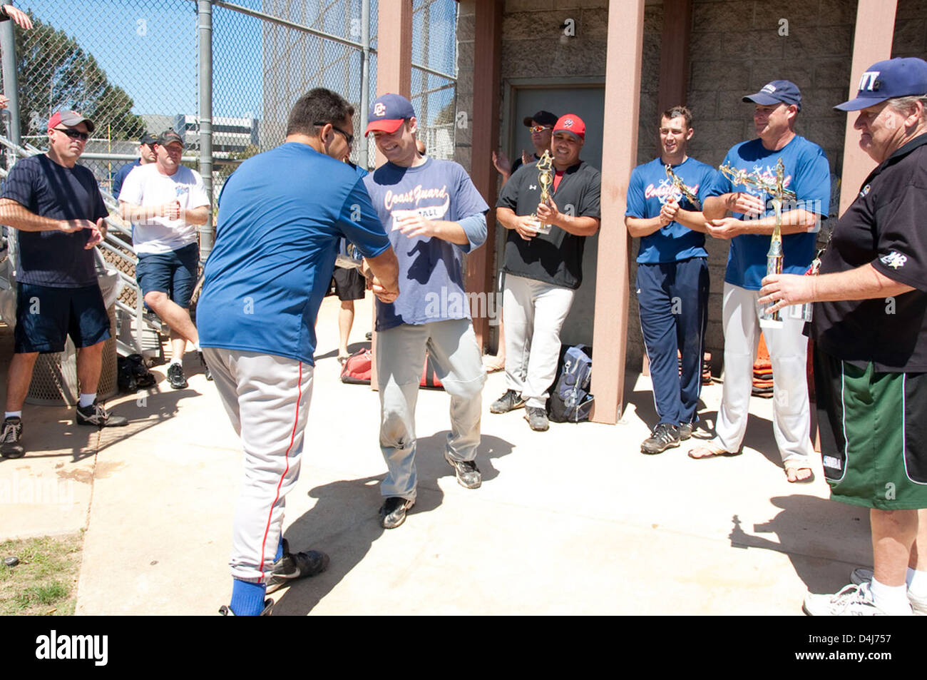 A U.S. Coast Guard crew member in action aboard a vessel during a ...