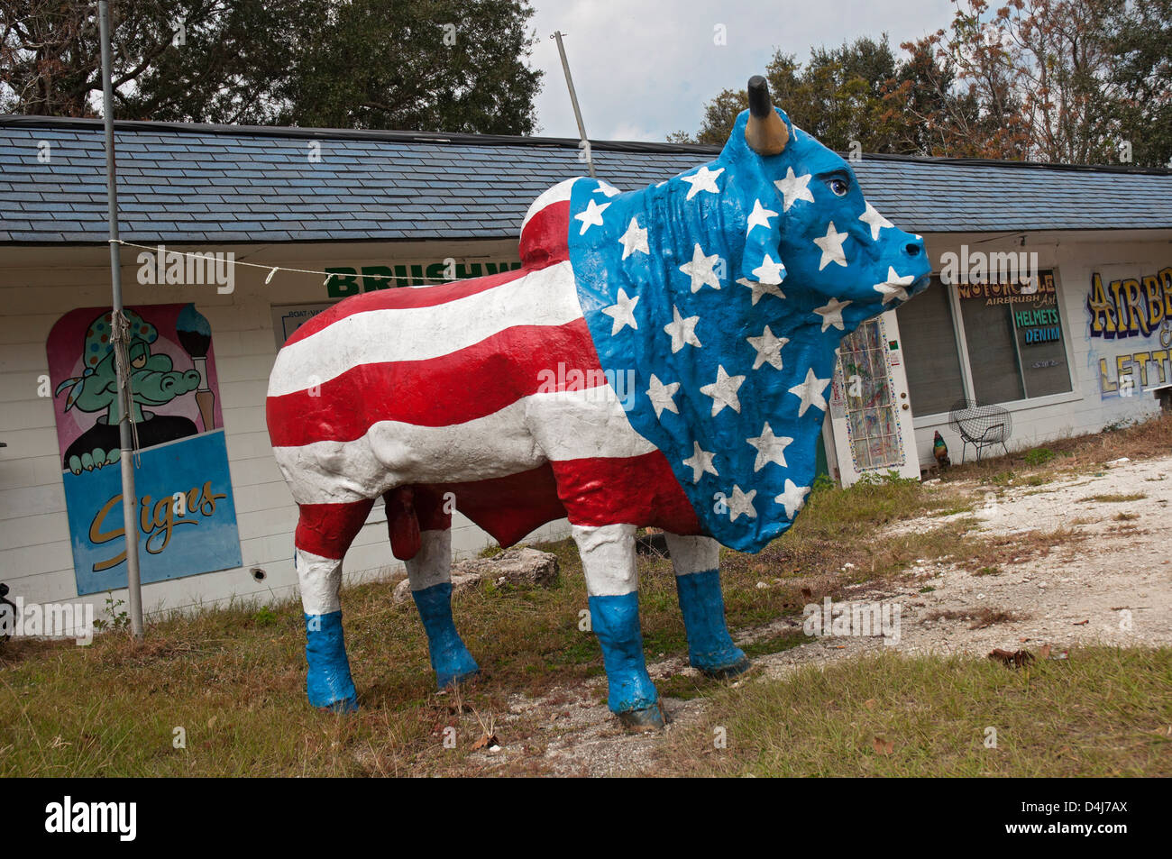 Painted bull advertises a commercial painting company Stock Photo - Alamy