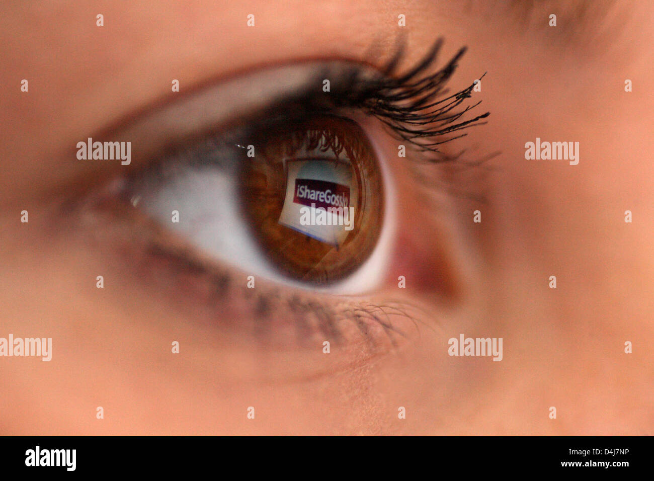 Berlin, Germany, mirroring the I Share Gossip logos in the eye of a ...