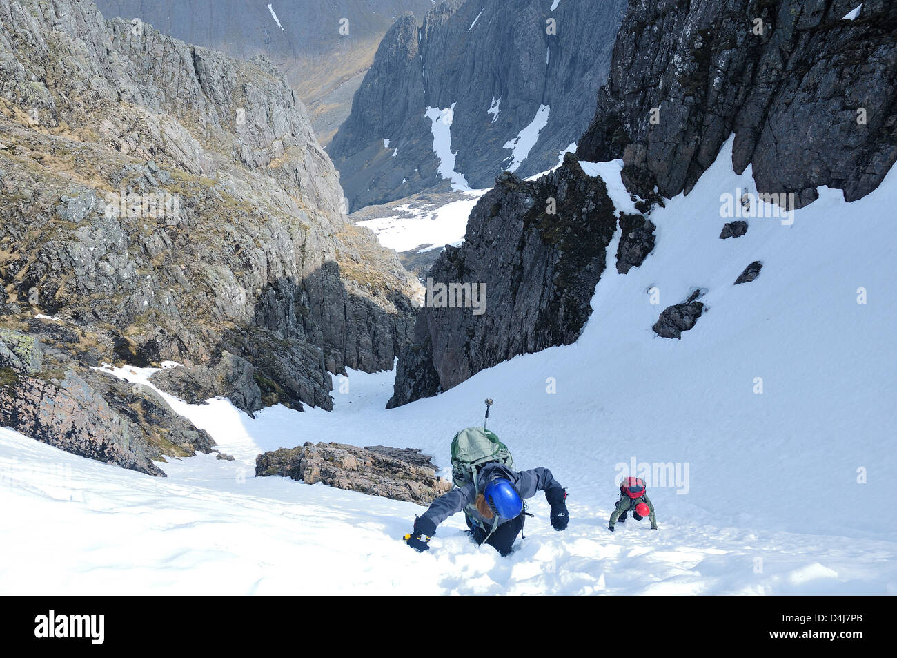 Two climbers descending No. 4 Gully on Ben Nevis after completing a ...