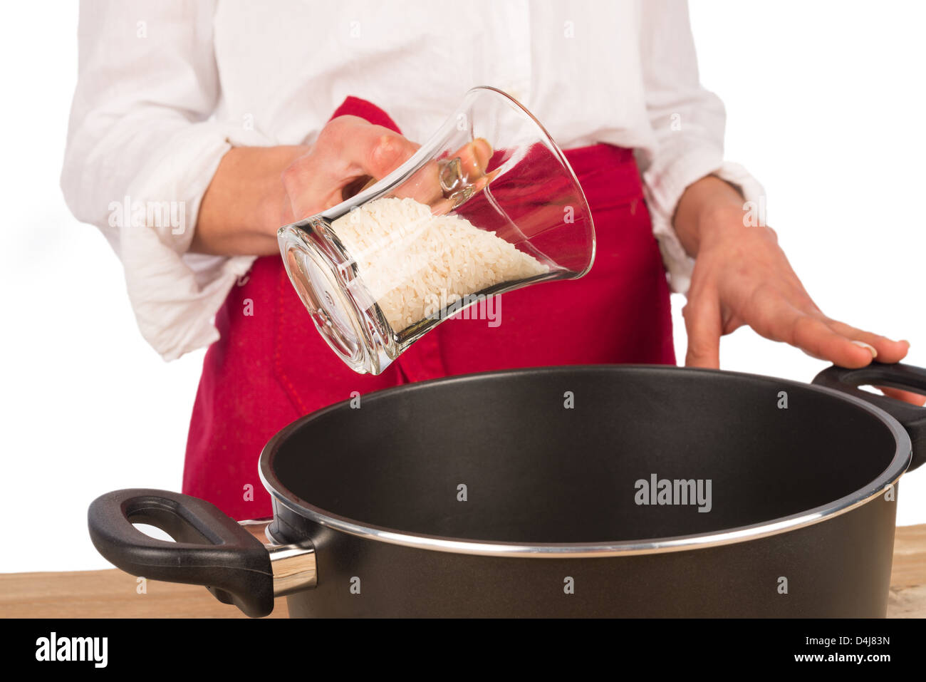 Rice about to be poured into a stewing pot Stock Photo - Alamy