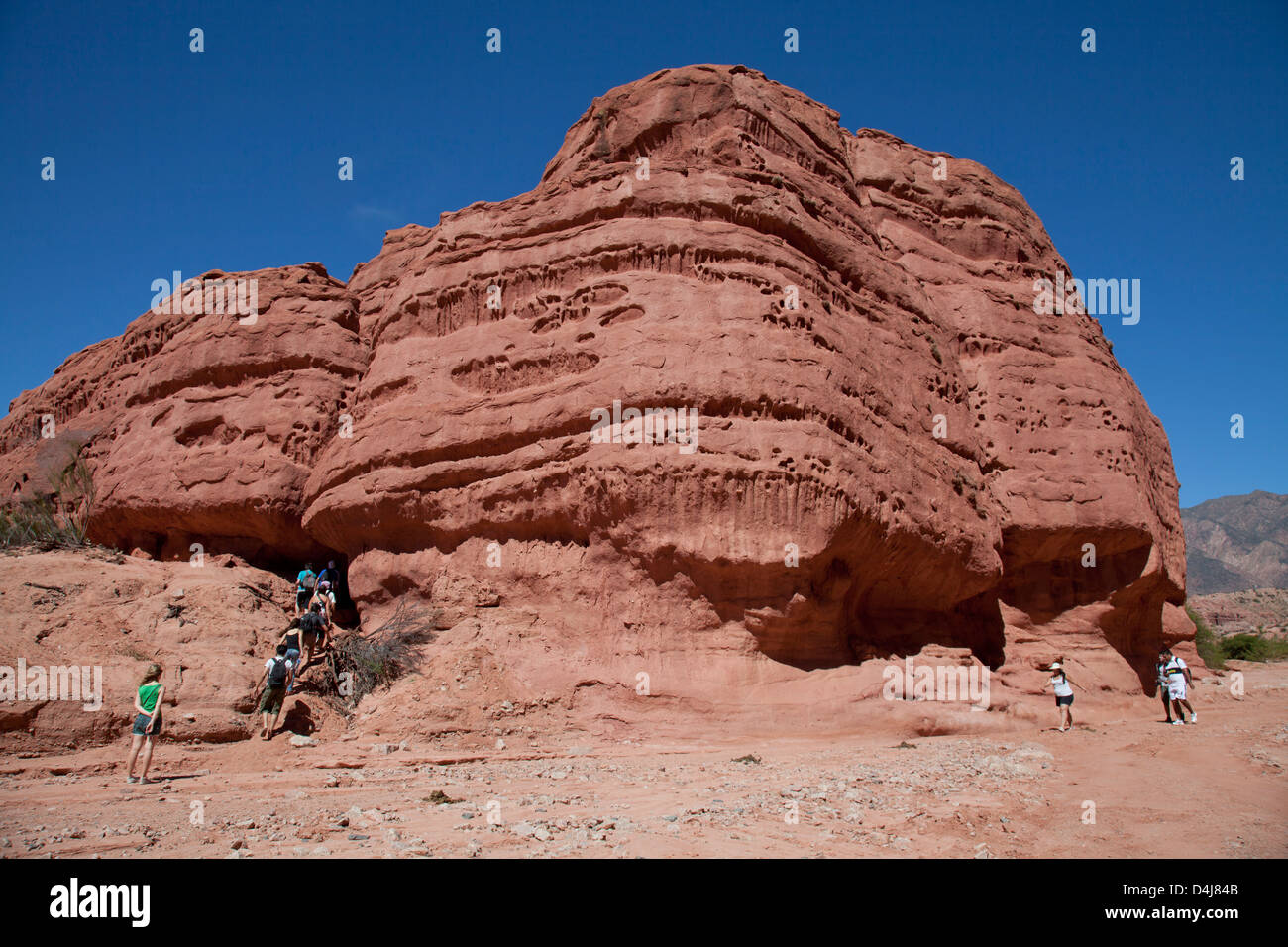 Tourists visit rock formations and canyons in the foothills of Andes in ...