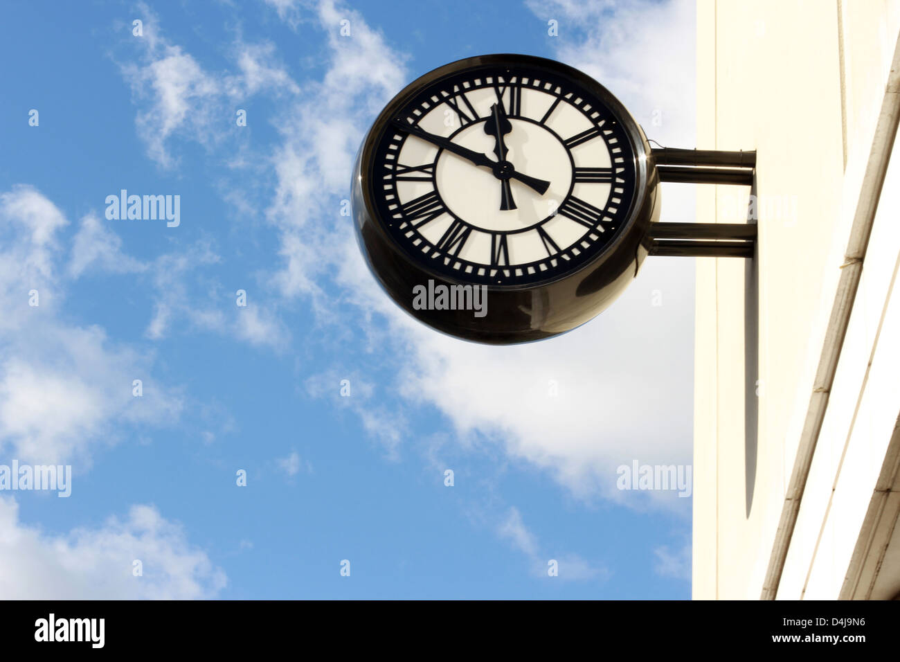 Clock on the side of a building Stock Photo - Alamy