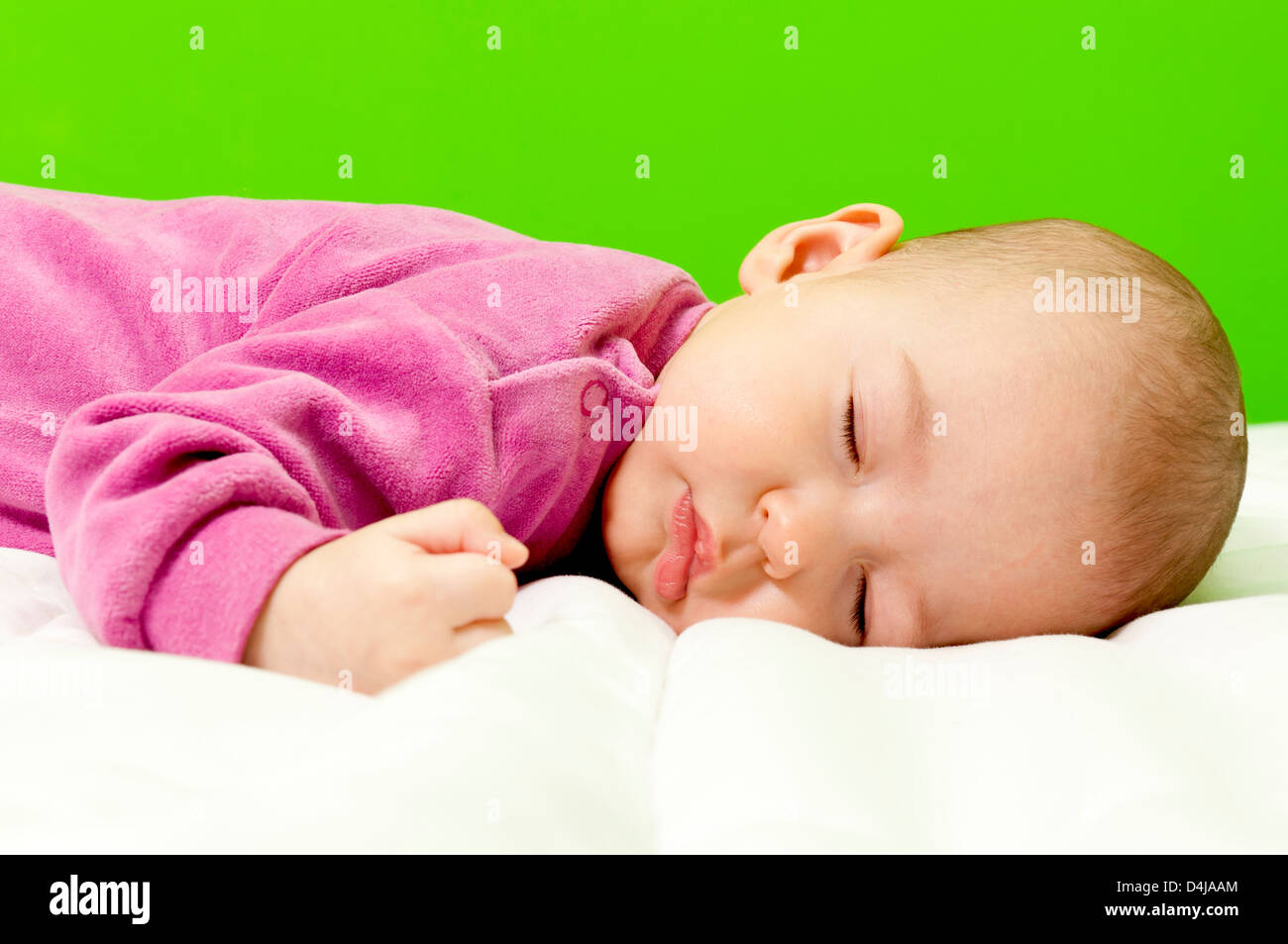 Baby girl having sweet dreams Stock Photo - Alamy