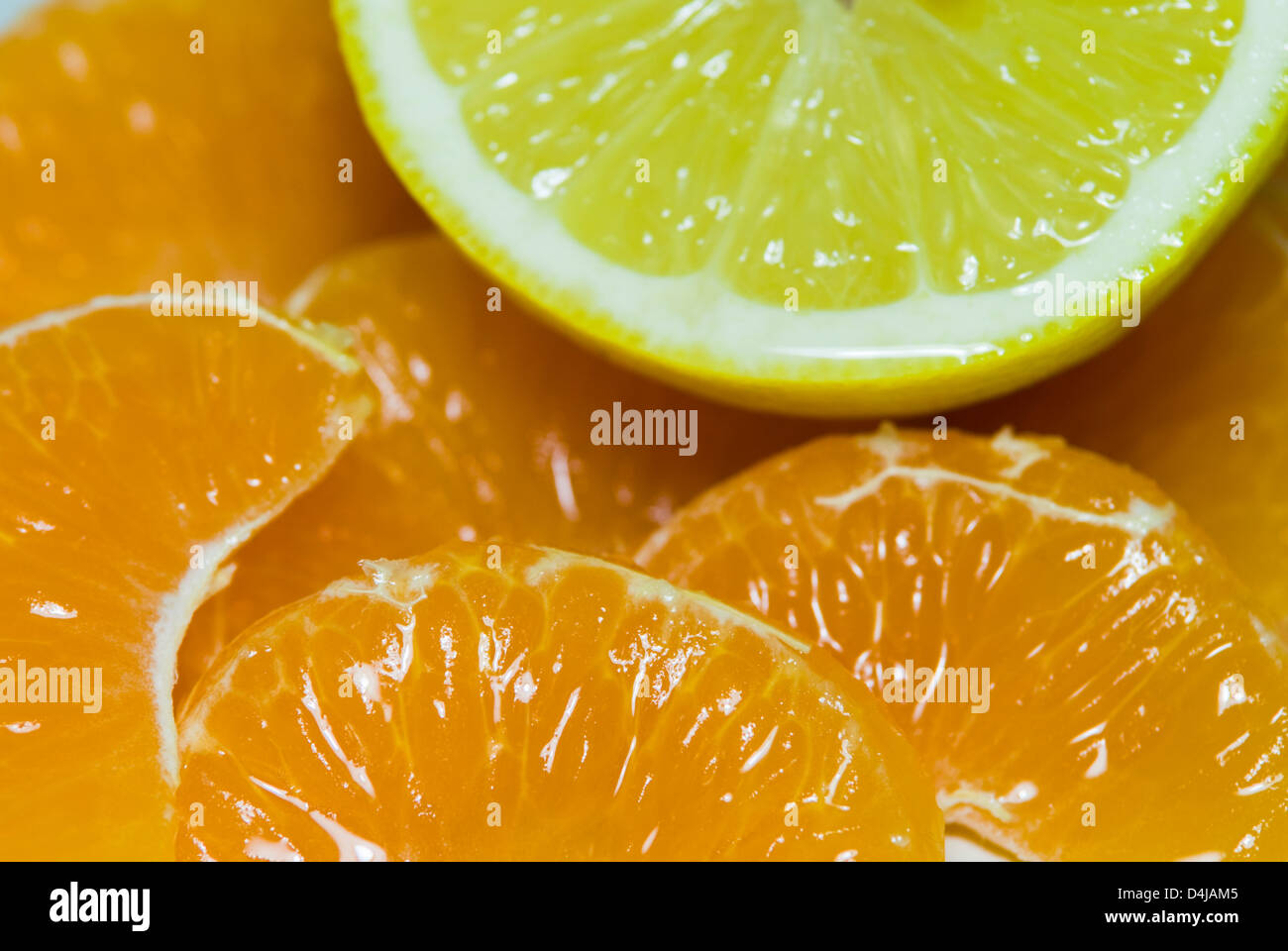 whole mandarin orange segments on with serving of lemon Stock Photo - Alamy