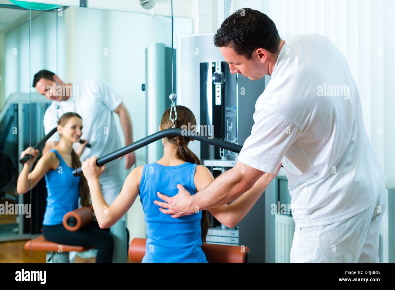 Patient at the physiotherapy making physical exercises with her ...