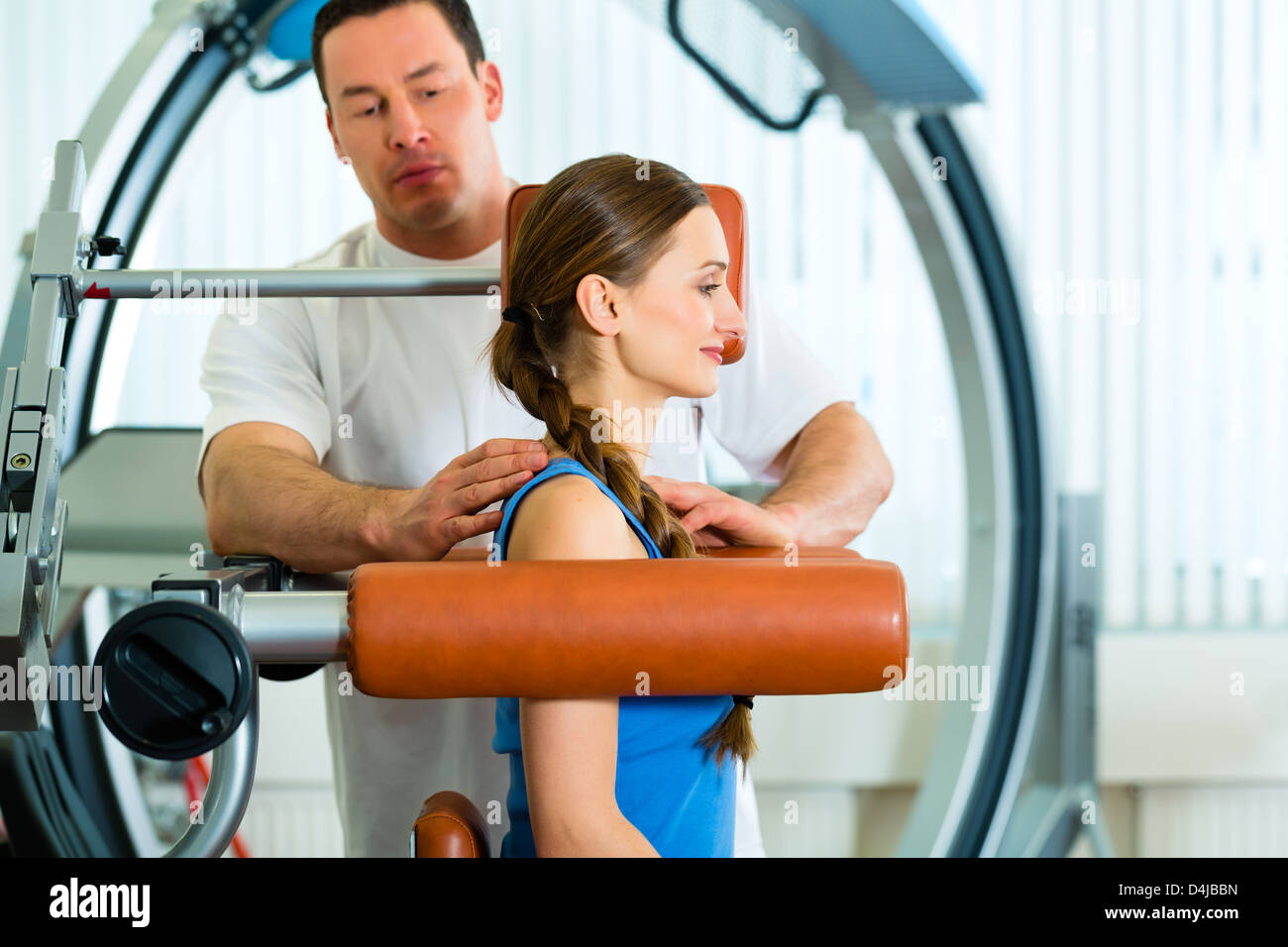 Patient at the physiotherapy making physical exercises with her ...