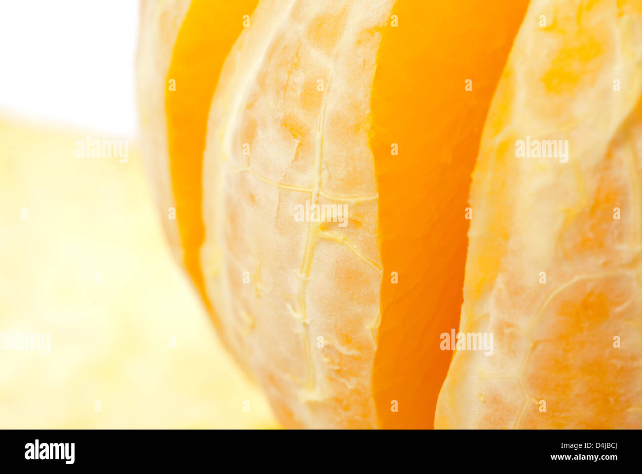 Unpeeled orange against white background Stock Photo - Alamy