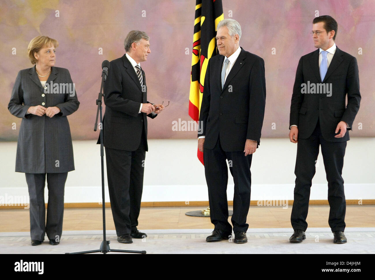 German President Horst Koehler (2-L) hands new Economy Minister Karl ...