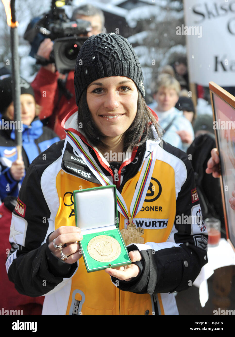 German skier Kathrin Hoelzl (C) is welcomed in Bischofswiesen, Germany ...
