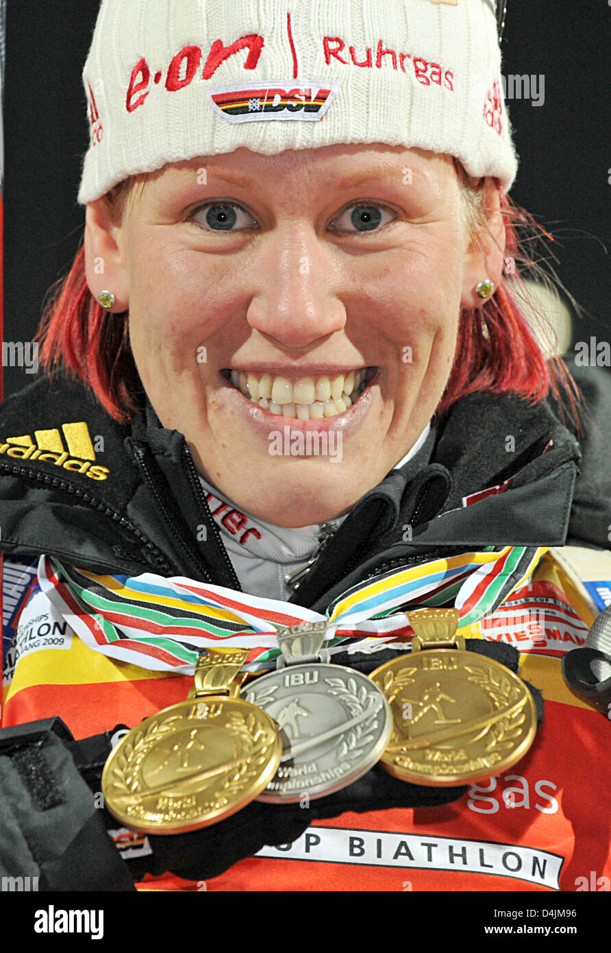 German Kati Wilhelm presents her medals after the women?s single ...