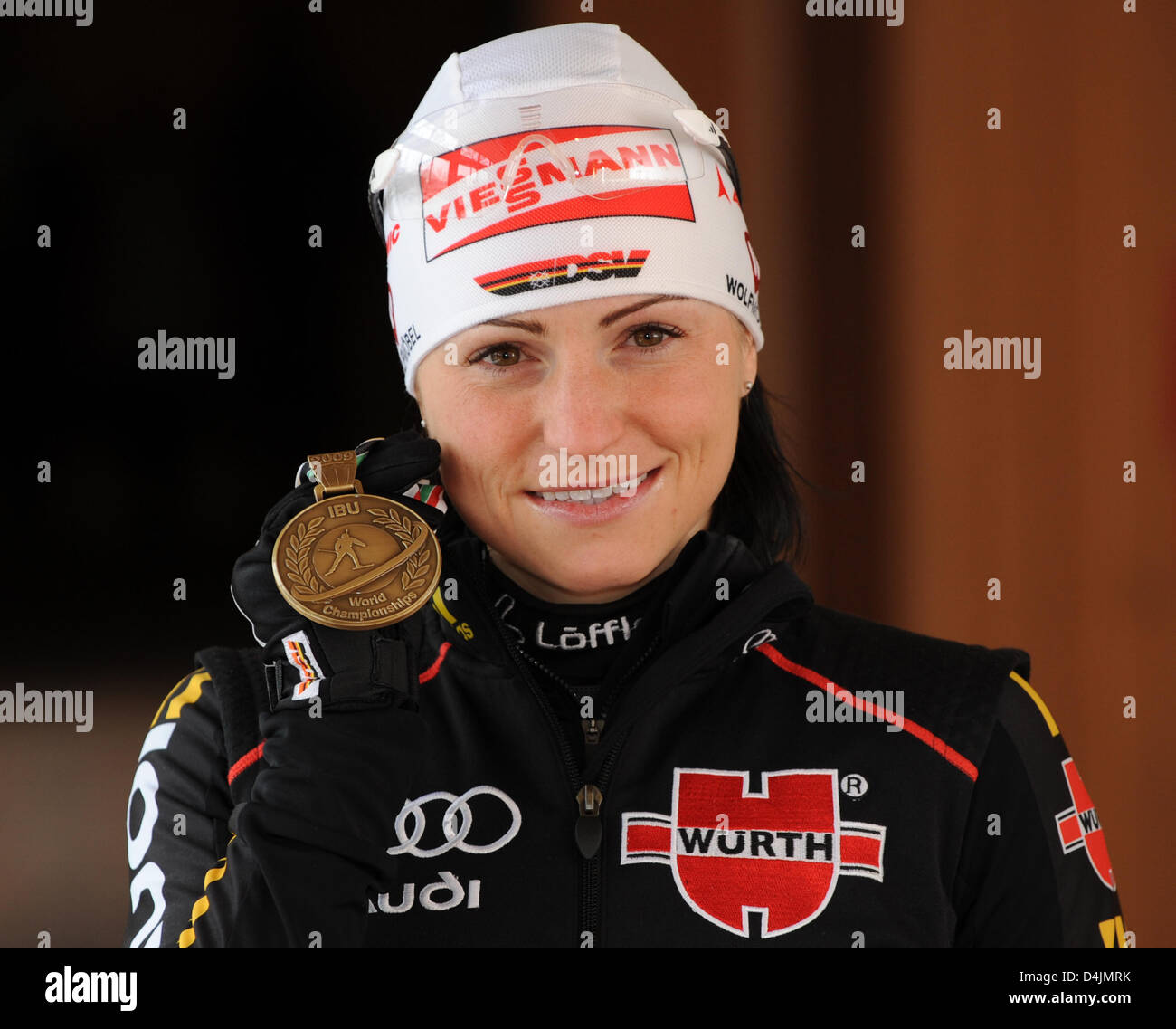 Germany?s Andrea Henkel shows her bronze medal at the Biathlon World ...