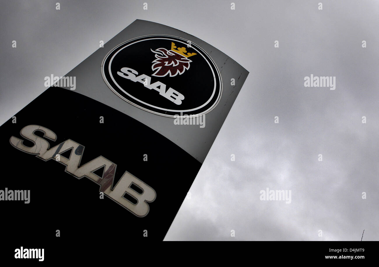 The picture shows a Saab logo on the premises of a car dealer in ...