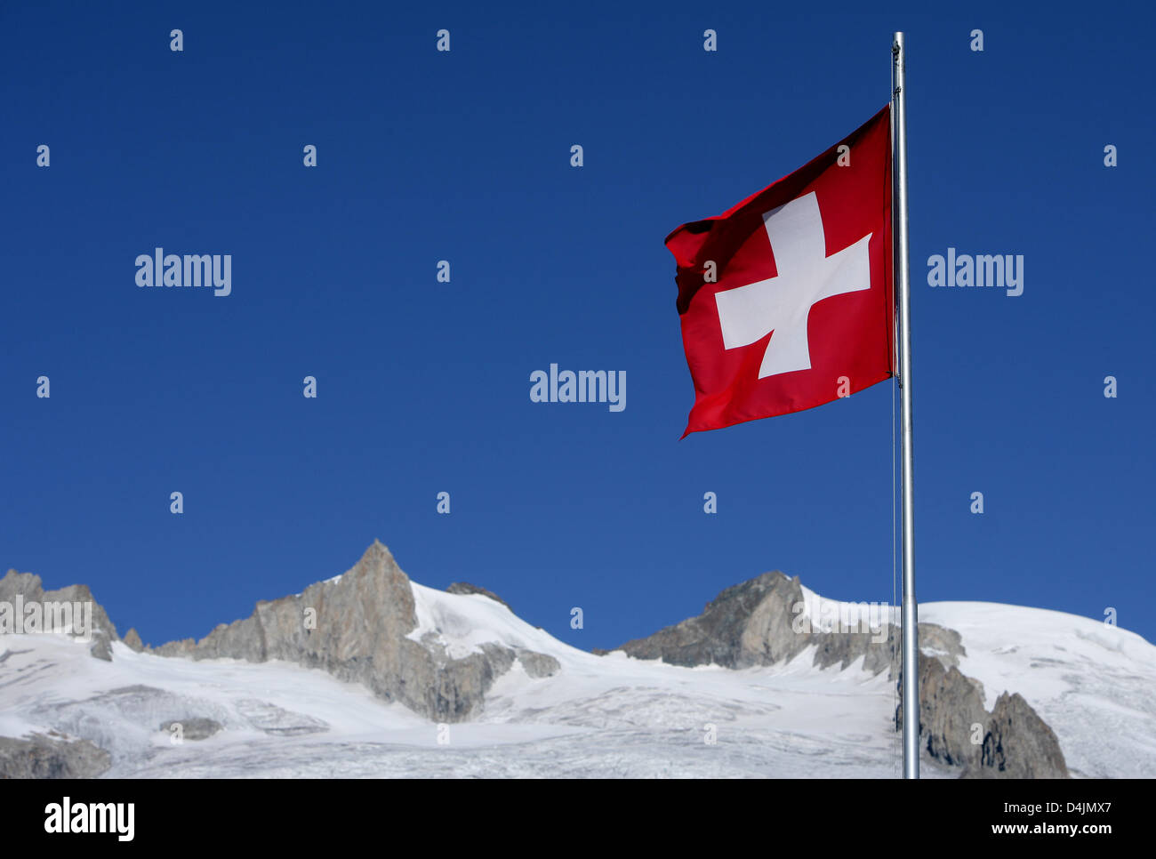 (dpa file)- The Swiss flag flies at Aletsch Glacier near Riederalp ...