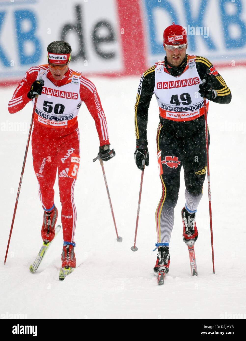 Germany?s Axel Teichmann (R) is overtaken by Swiss skier Dario Cologna ...