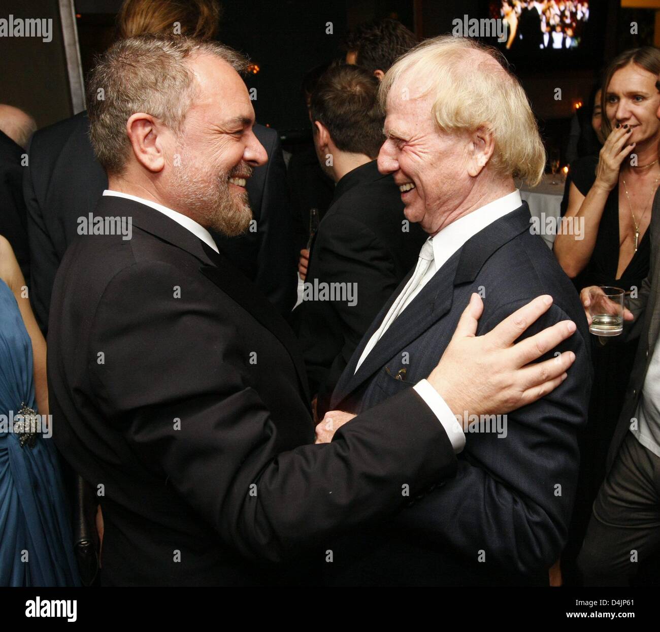 German directors Wolfgang Petersen (R) and Uli Edel celebrate at a ...