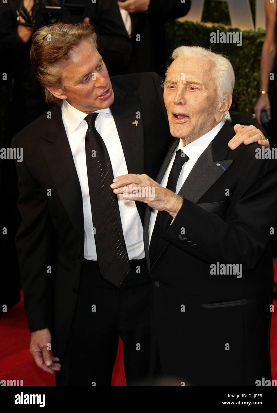 Actor Michael Douglas (L) and his father, actor Kirk Douglas, arrive at ...