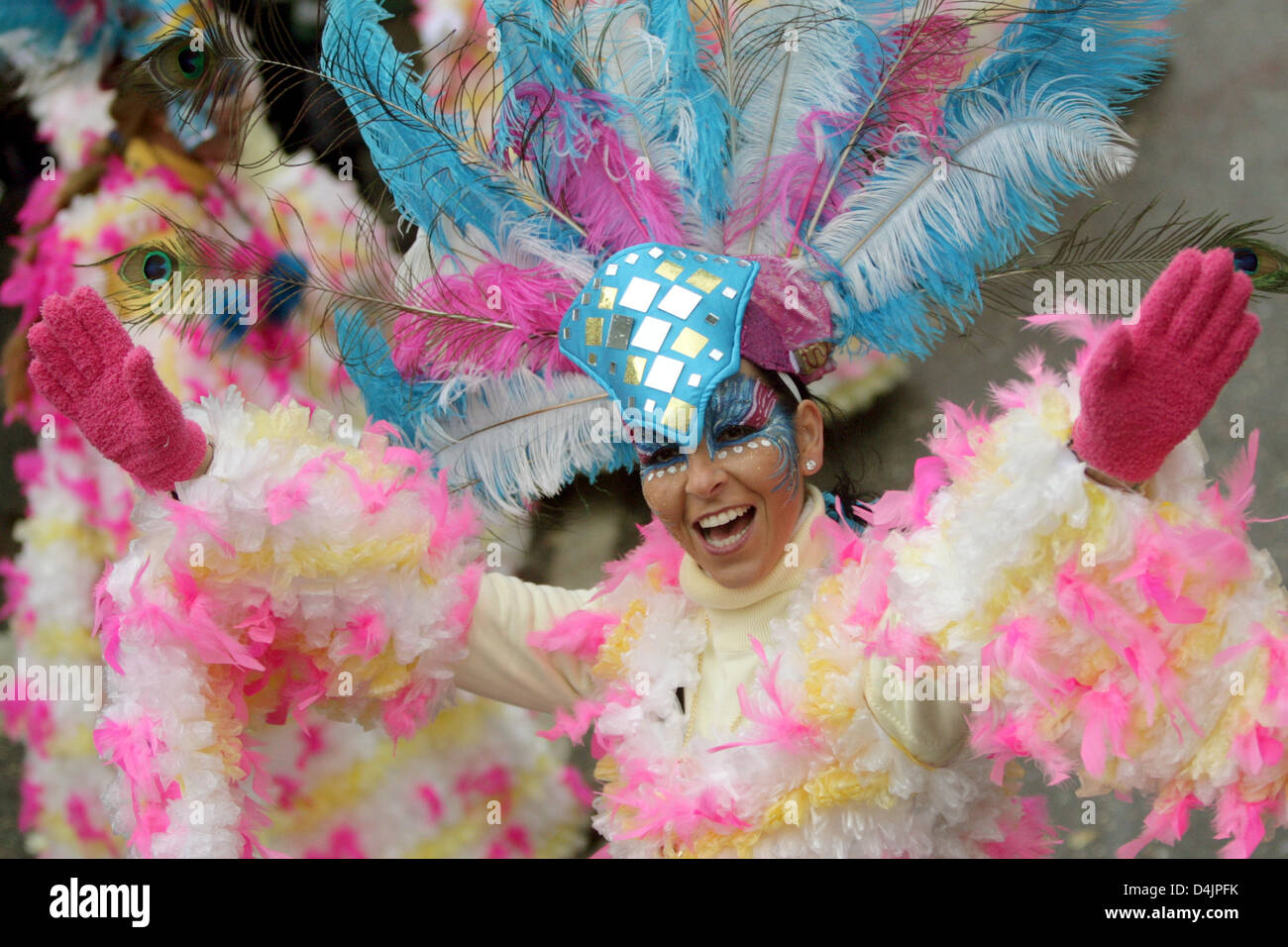 A costumed woman forms part of the Shrove Monday parade in Mainz ...