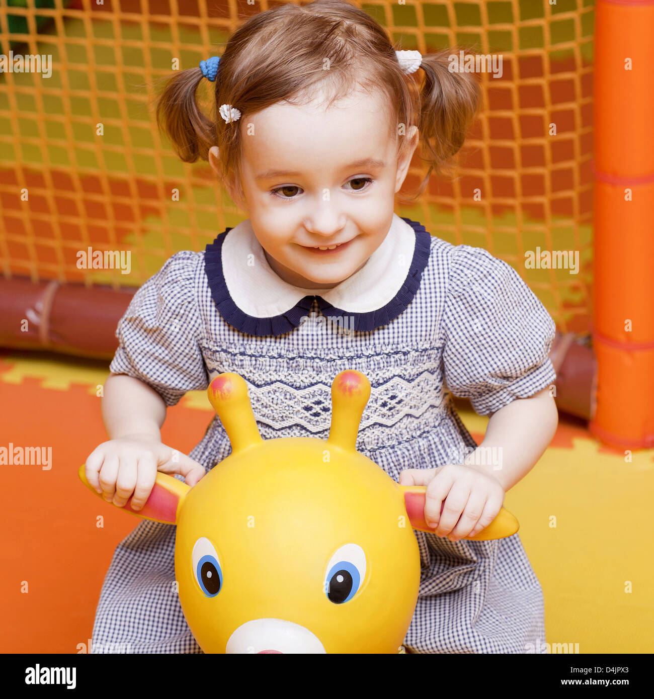 little happy girl on playground laughing Stock Photo - Alamy