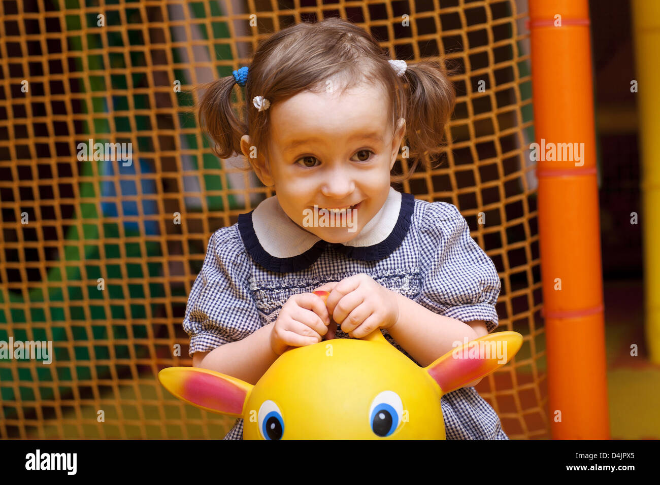 little happy girl on playground laughing Stock Photo - Alamy