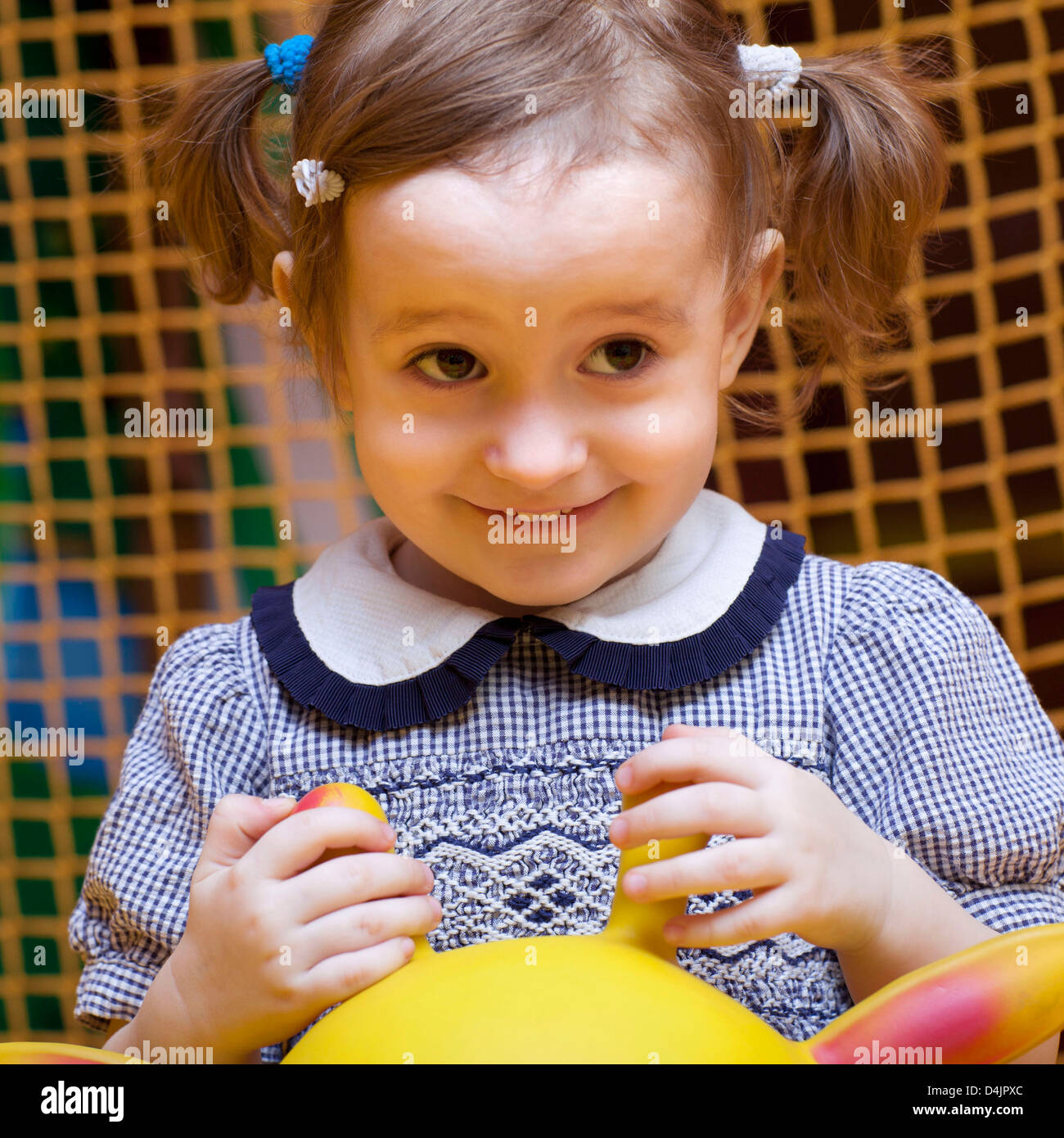 little happy girl on playground laughing Stock Photo - Alamy