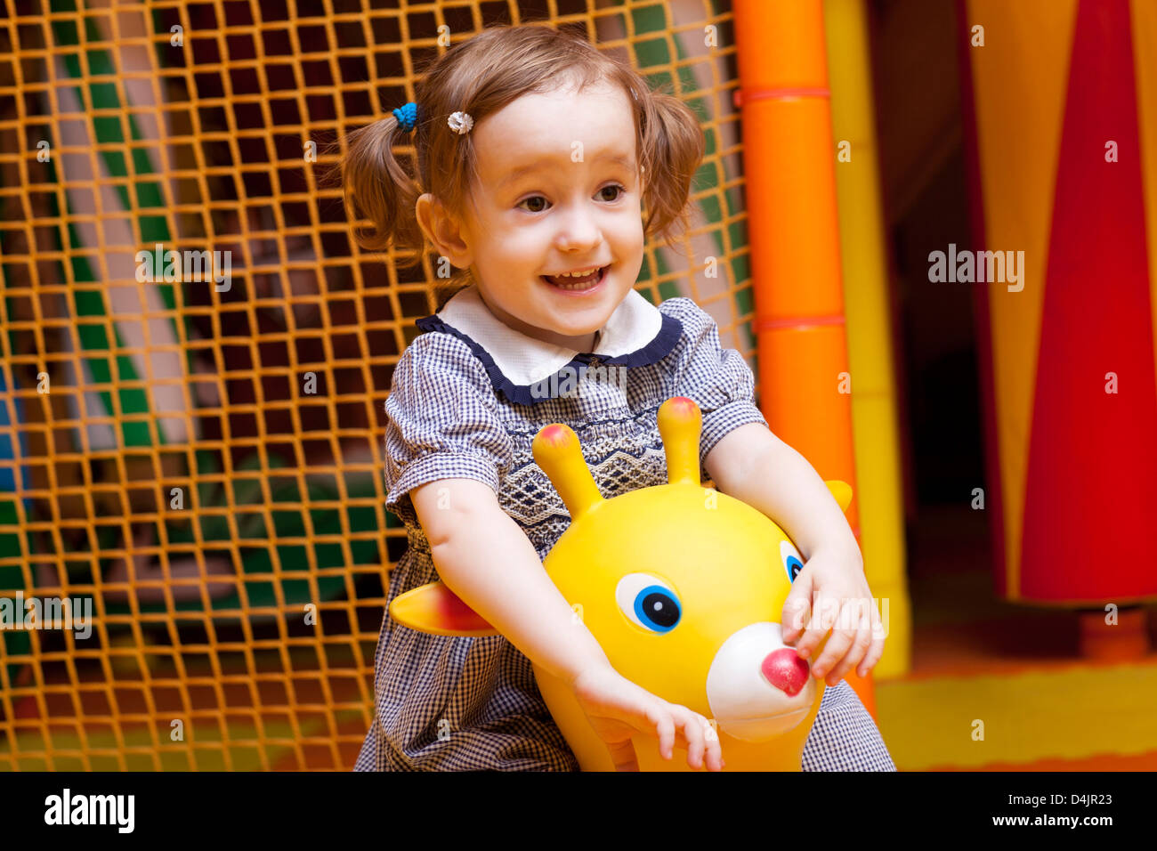 little happy girl on playground laughing Stock Photo - Alamy