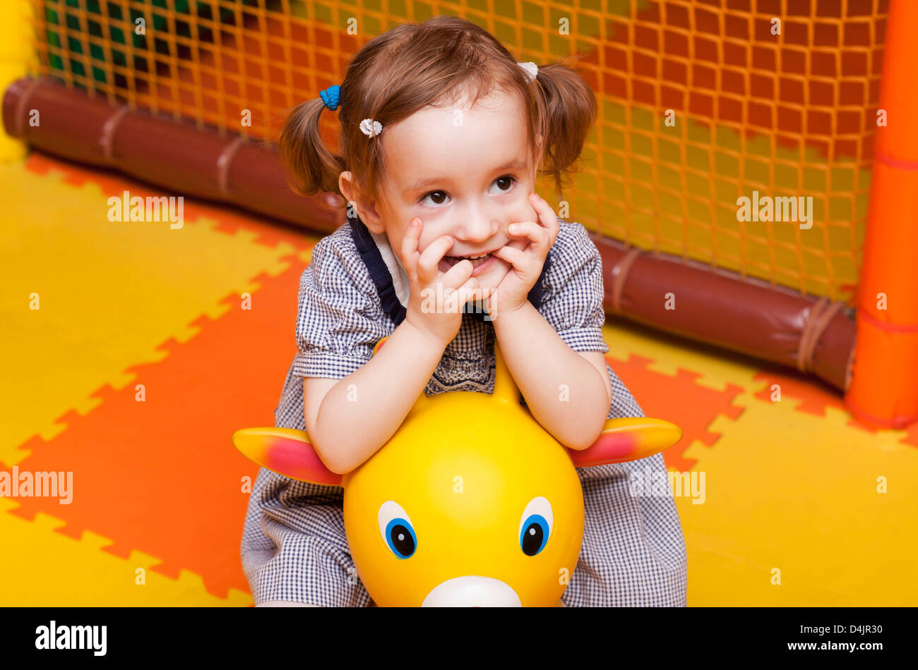 little happy girl on playground laughing Stock Photo - Alamy
