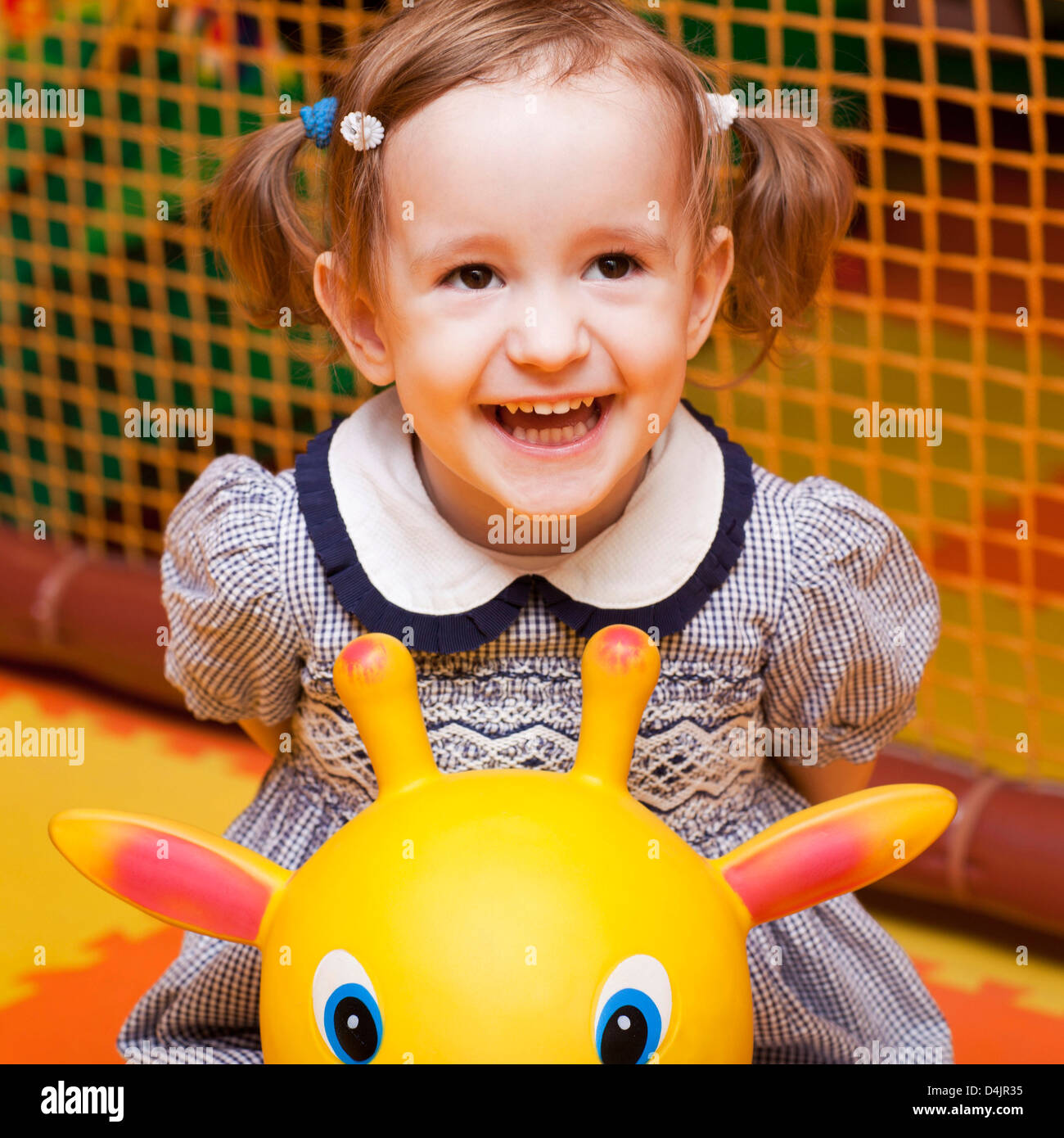 little happy girl on playground laughing Stock Photo - Alamy