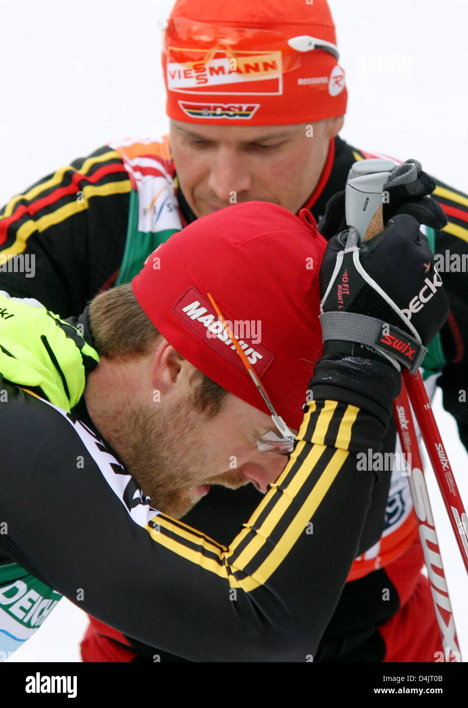 Germany?s Axel Teichmann (front) is consoled by his team-mate Tobias ...