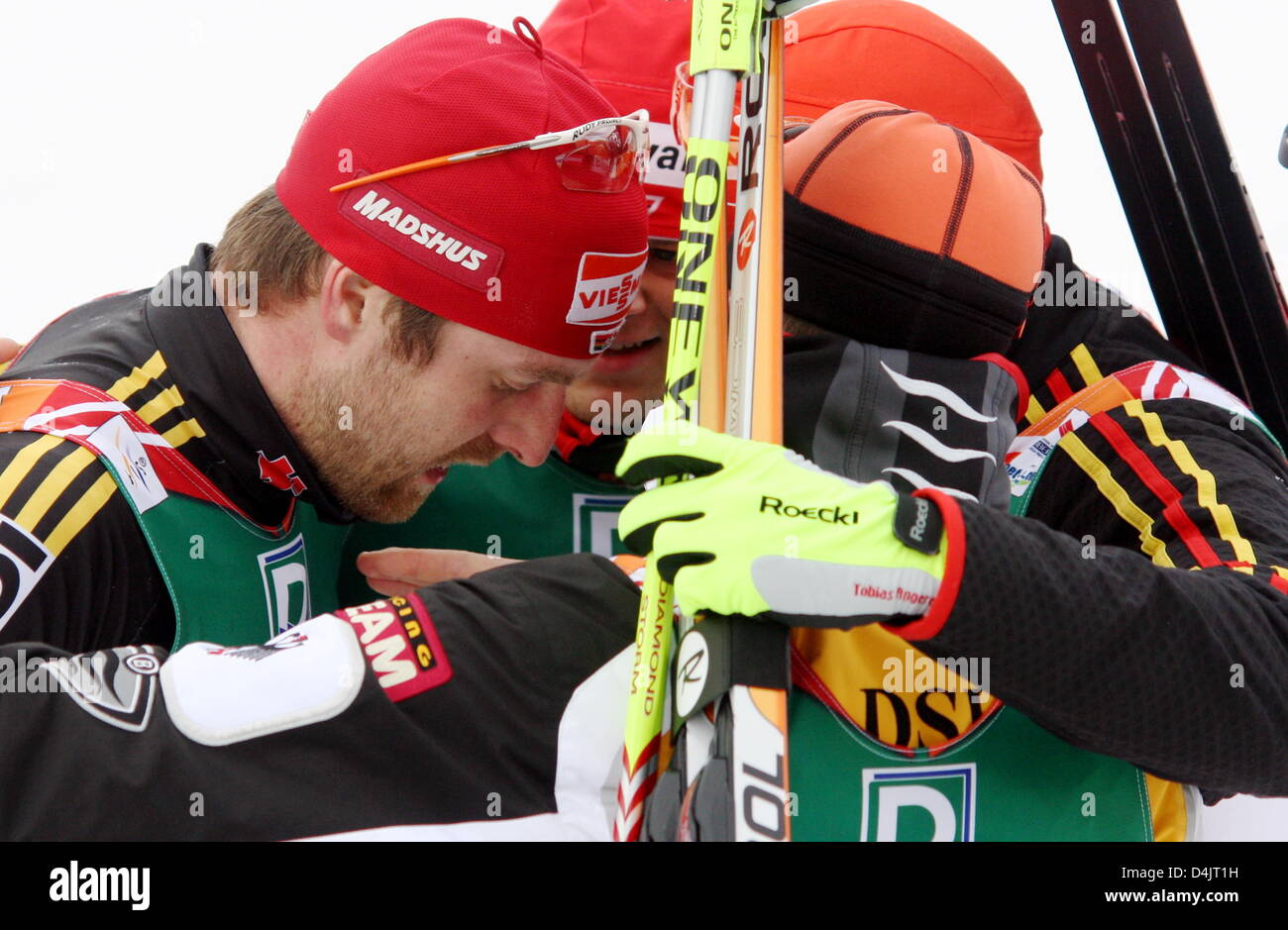 Germany?s Axel Teichmann (L) is consoled by his team-mates after the ...