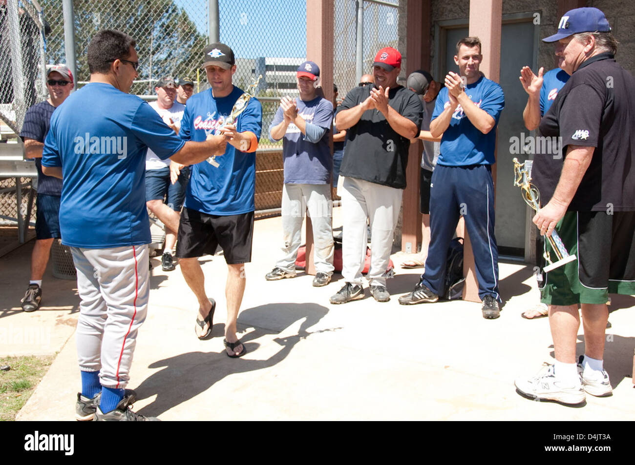 A U.S. Coast Guard personnel engages in maritime operations, showcasing ...