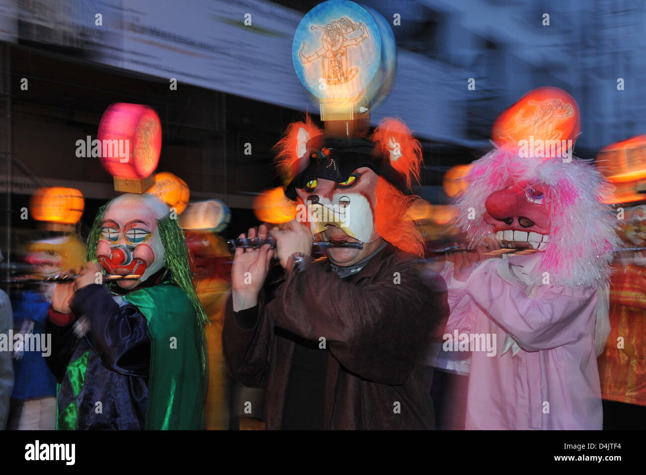 In the early morning hours carnival goers in fancy dresses making music ...