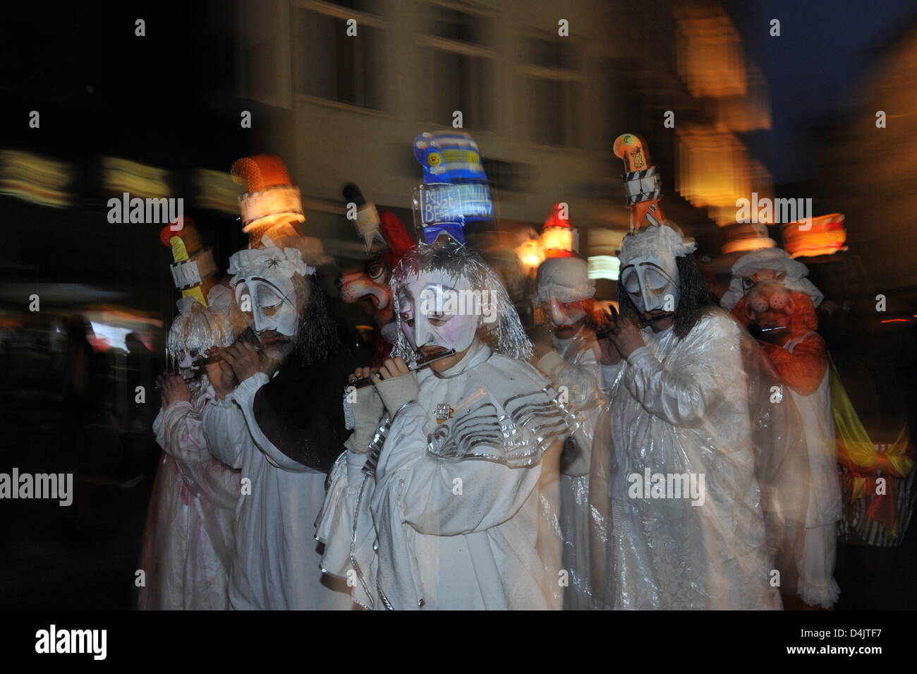 In the early morning hours carnival goers in fancy dresses making music ...