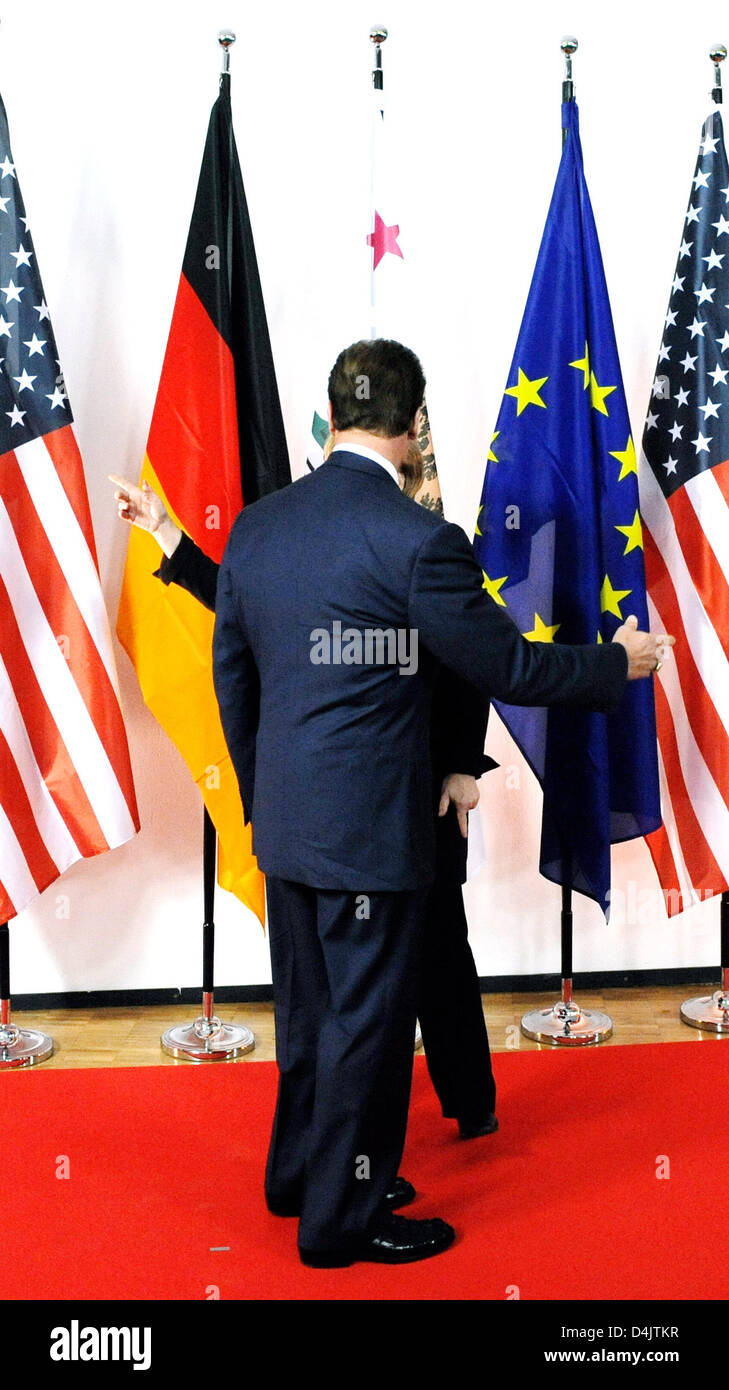 German Chancellor Angela Merkel (back) greets Governor of US state ...