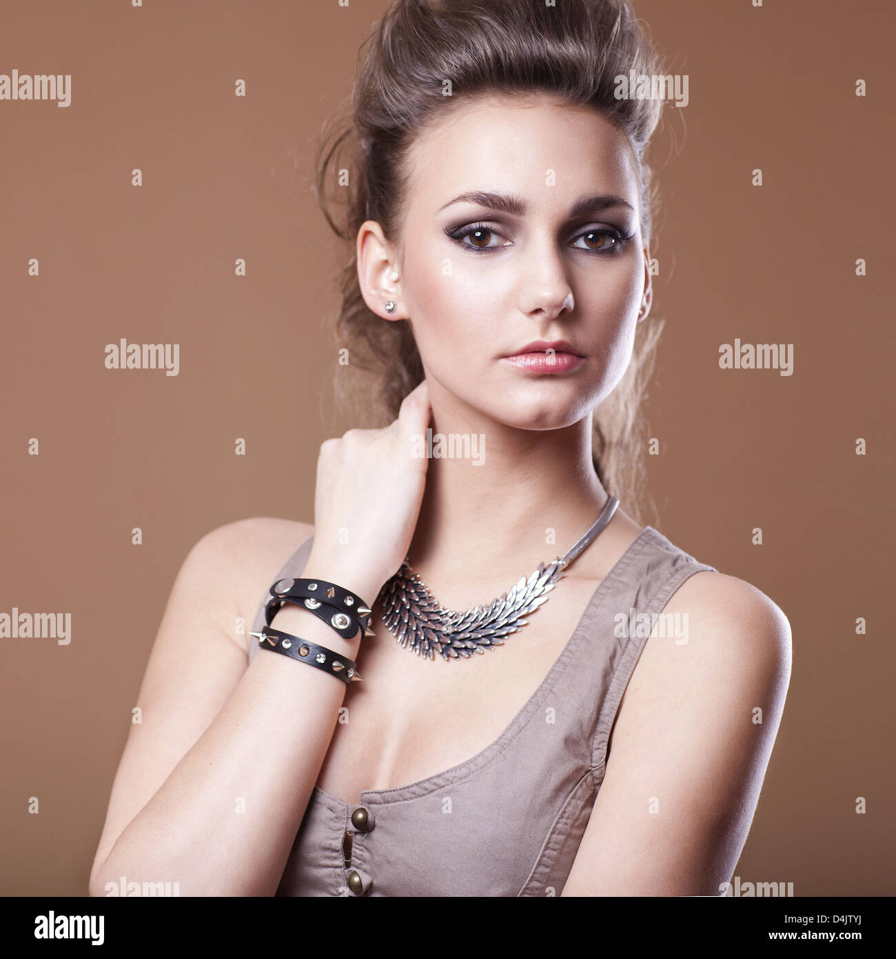 beautiful fashion woman with hairstyle posing in studio, close up ...