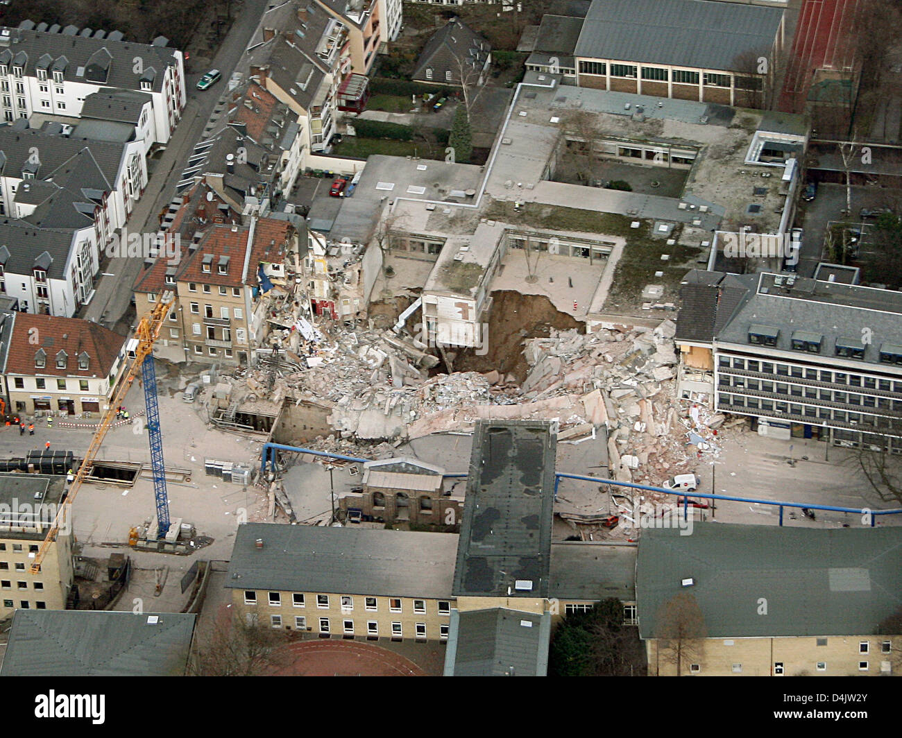 The photo provide an aerial view of the collapsed Historic City Archive ...