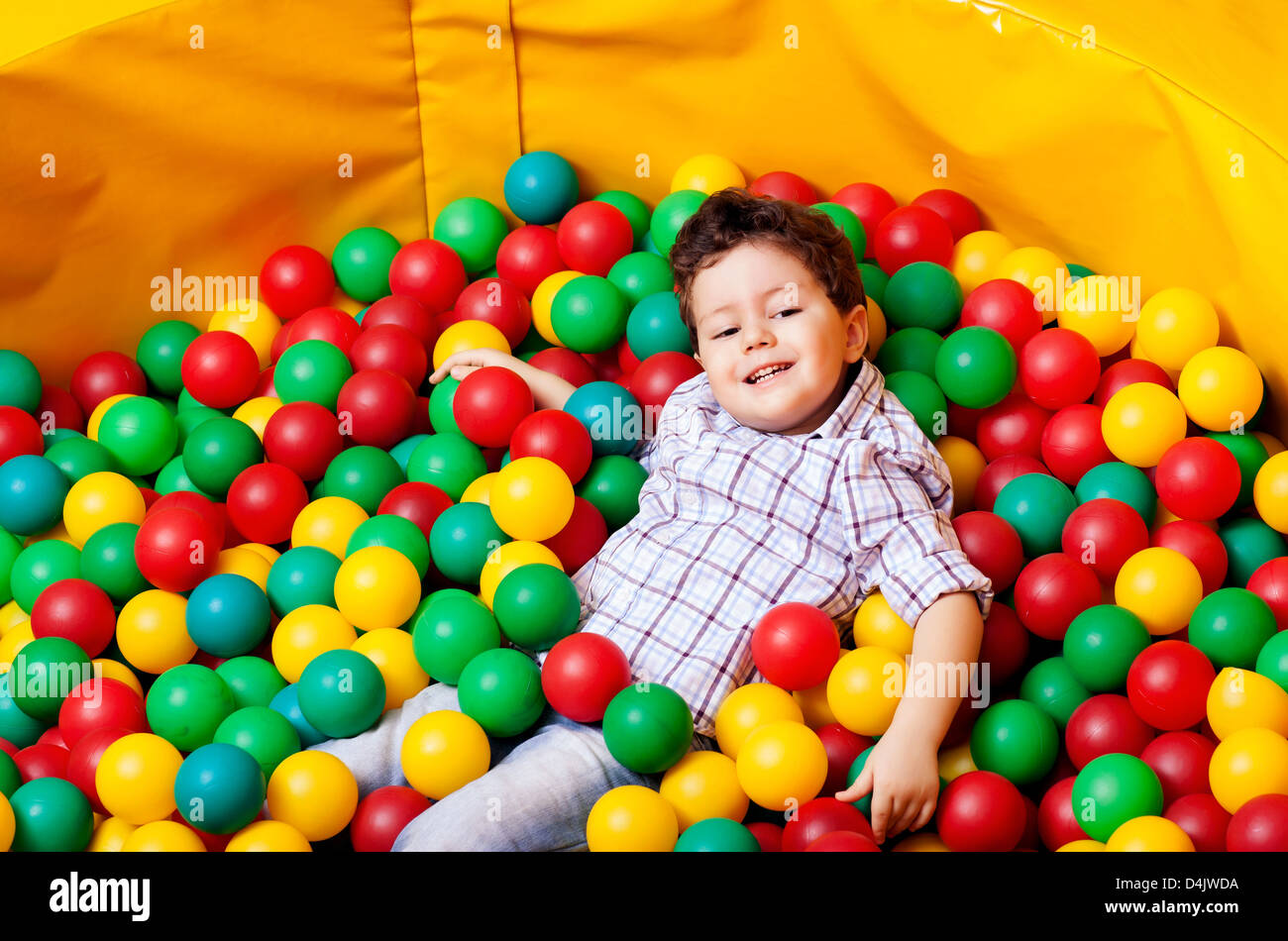 Child playing balls hi-res stock photography and images - Alamy