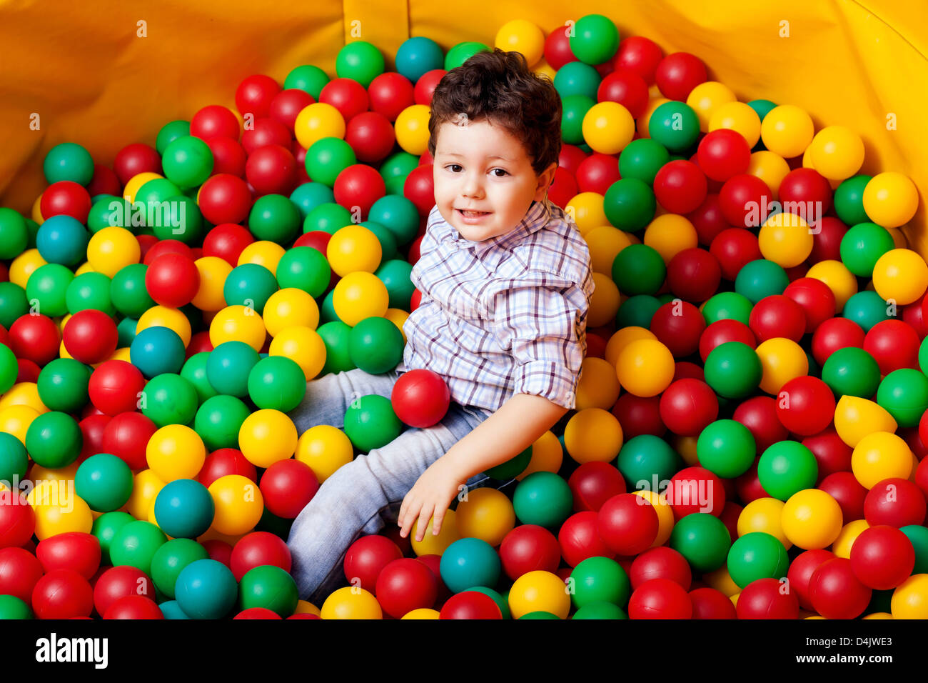 Kid playing balls hi-res stock photography and images - Alamy
